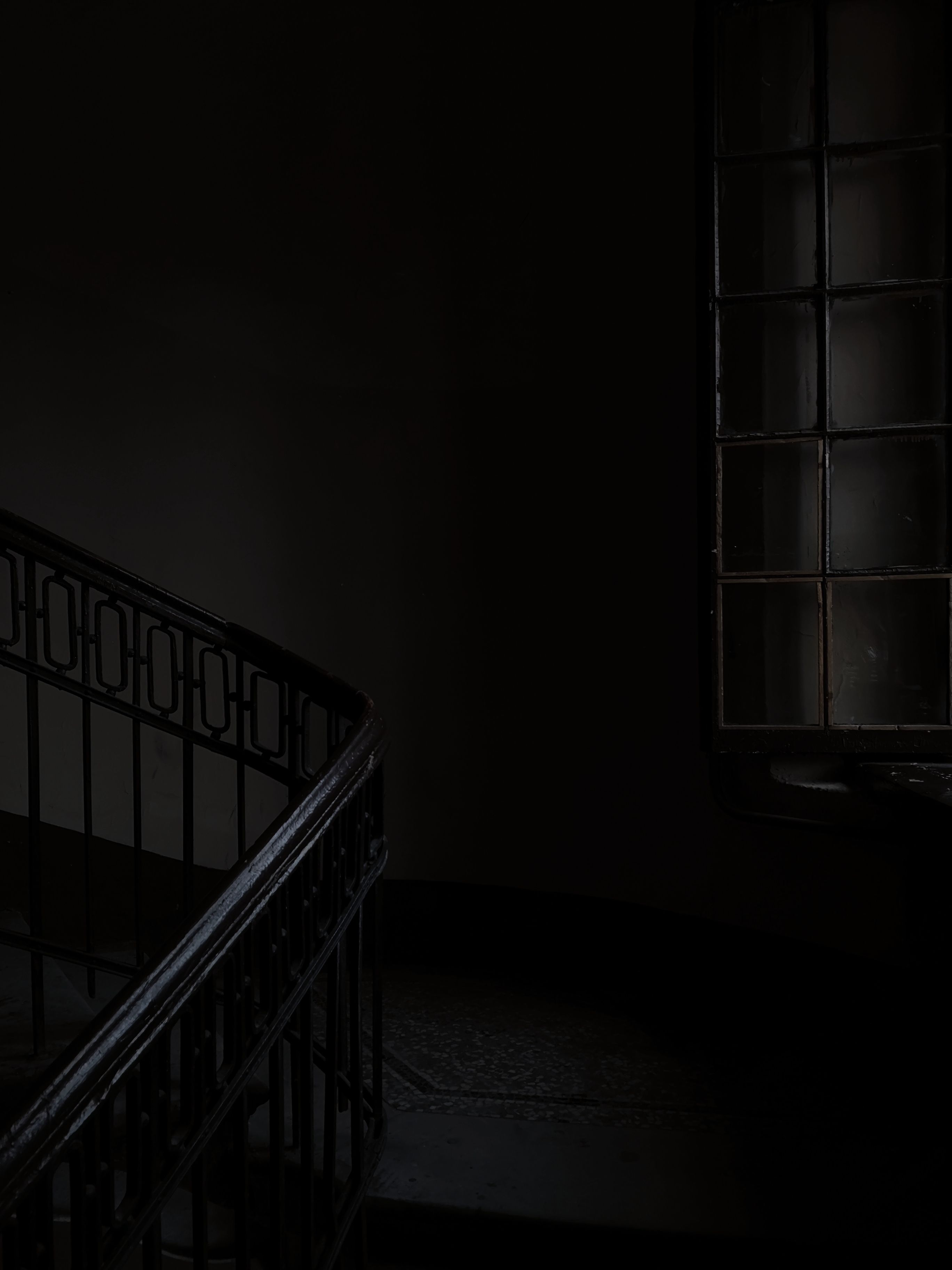 Dark staircase with black railings in residential building · Free Stock ...