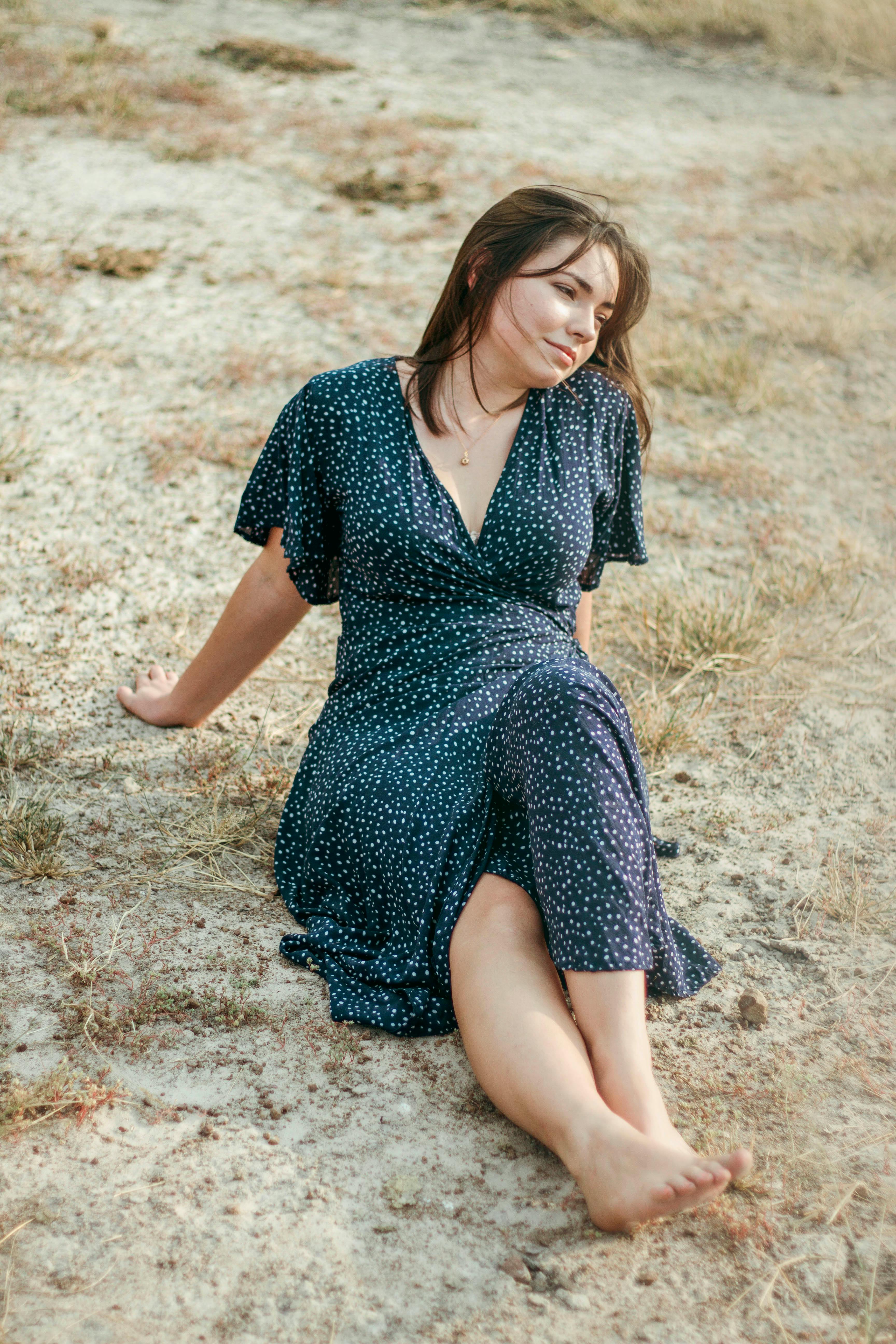 A Woman Sitting on the Ground · Free Stock Photo
