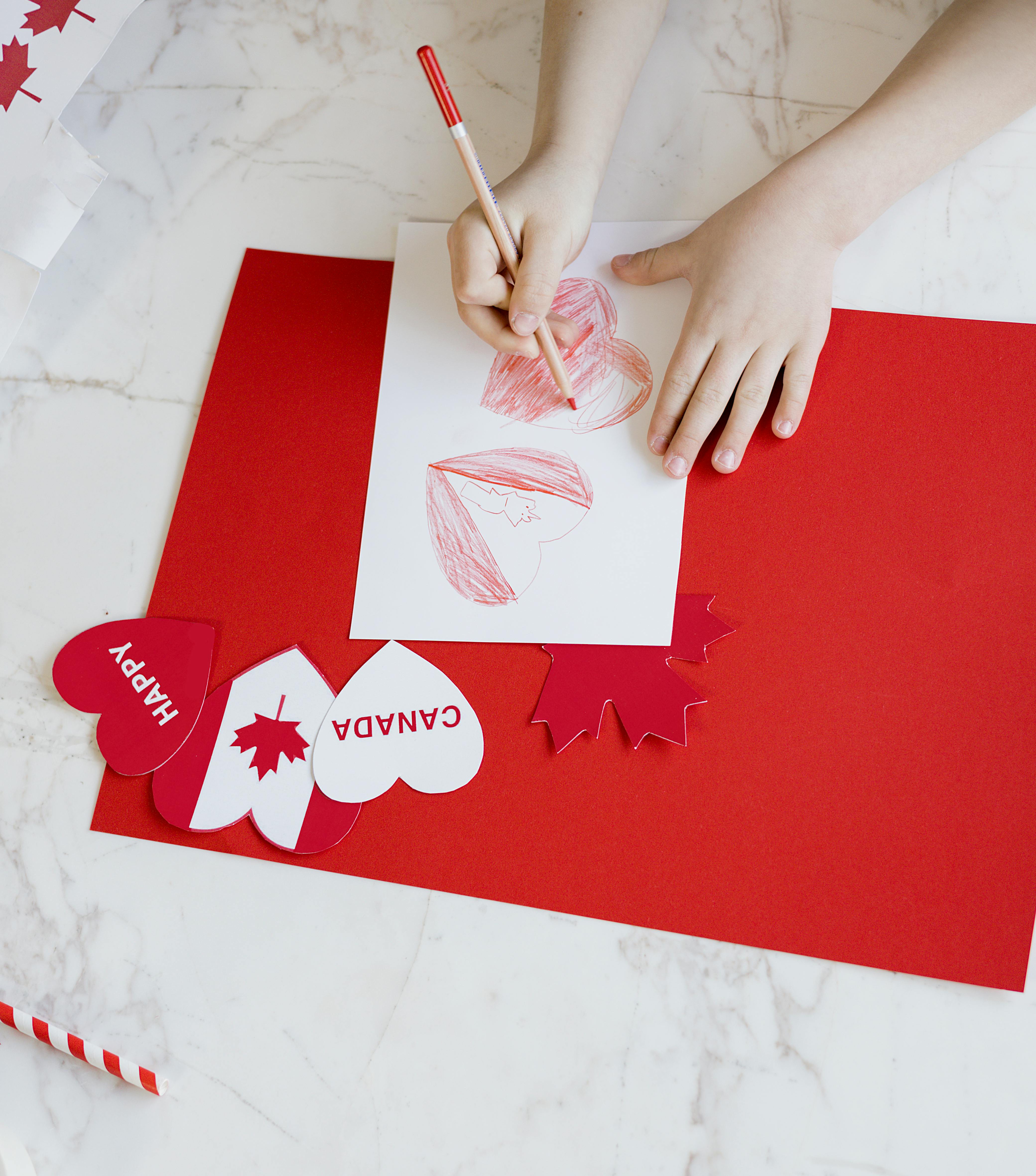 Hands of a Child Drawing Red Hearts on Paper · Free Stock Photo