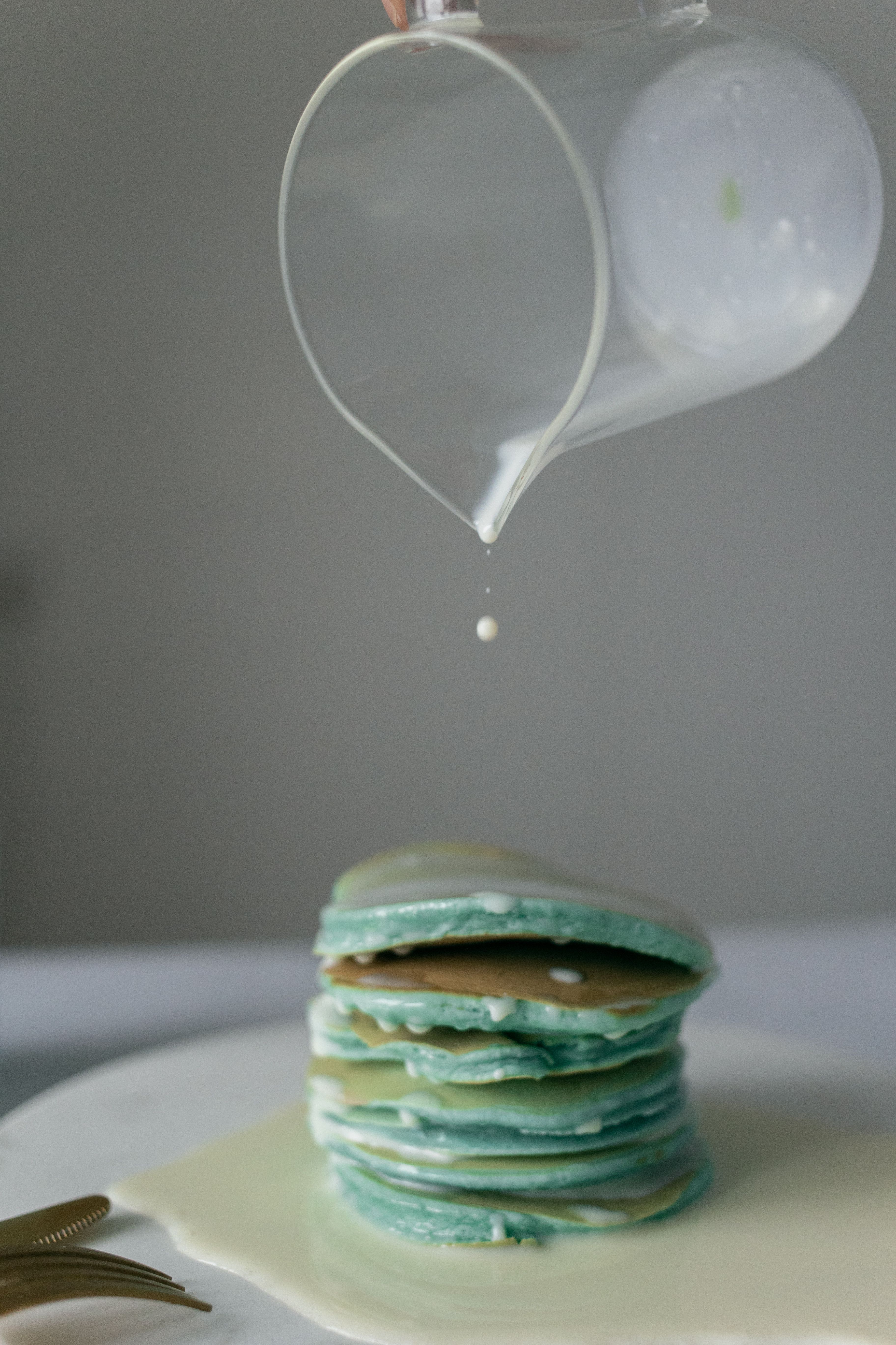 Mint pancakes poured with milk from plastic transparent jug · Free ...