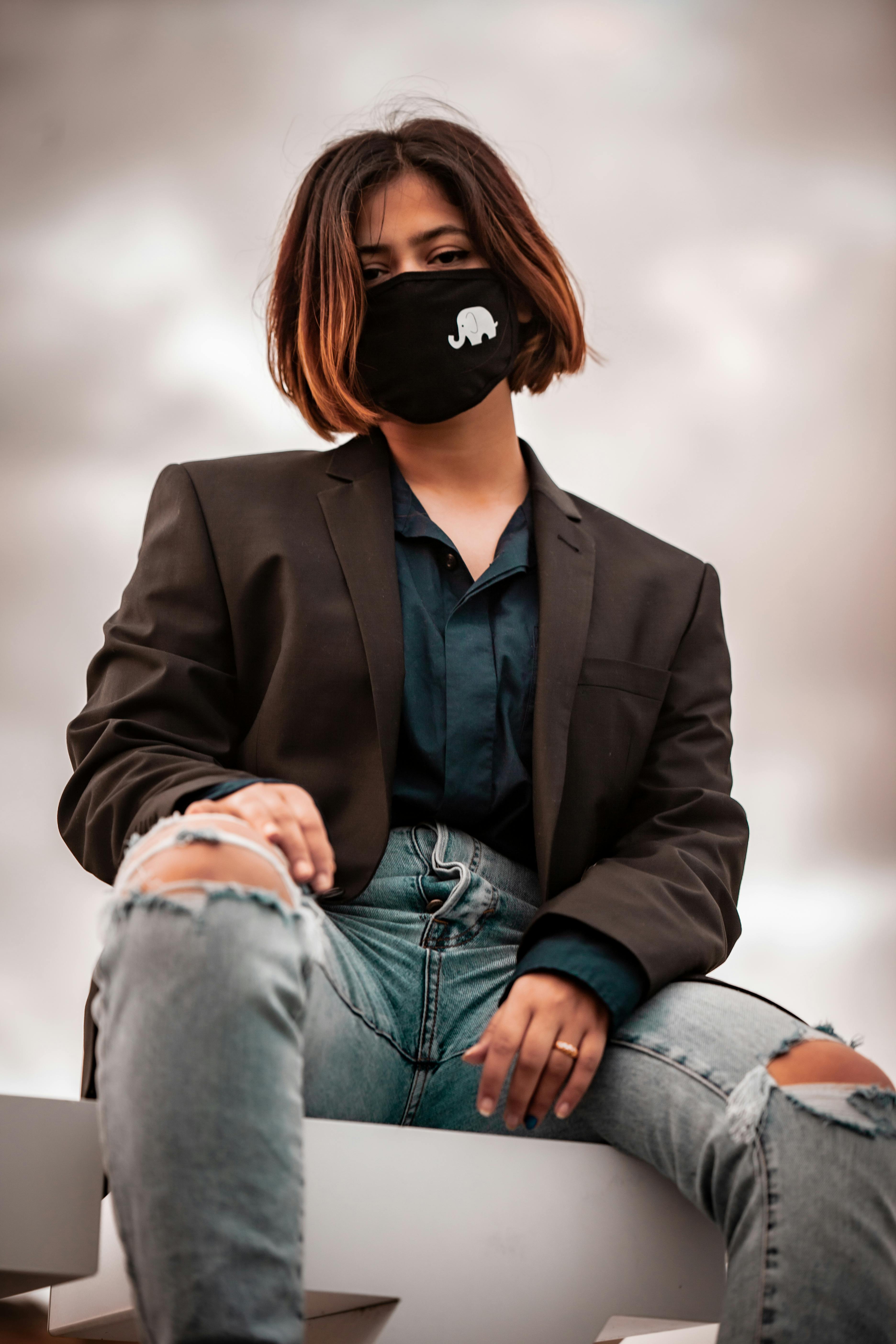 Person Wearing a Face Mask, Blazer and Ripped Denim Jeans · Free Stock ...