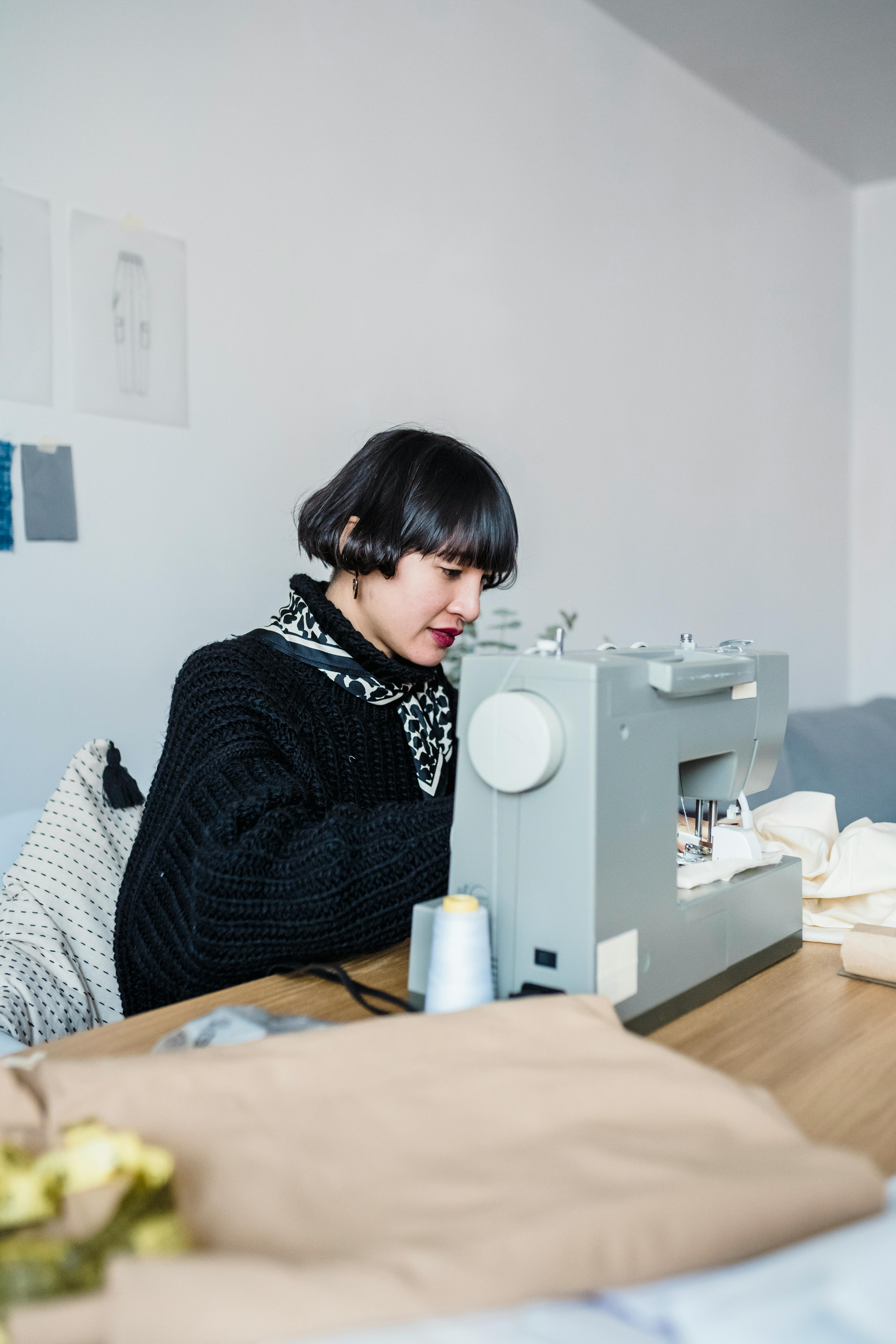 Photo of Woman Using Sewing Machine · Free Stock Photo