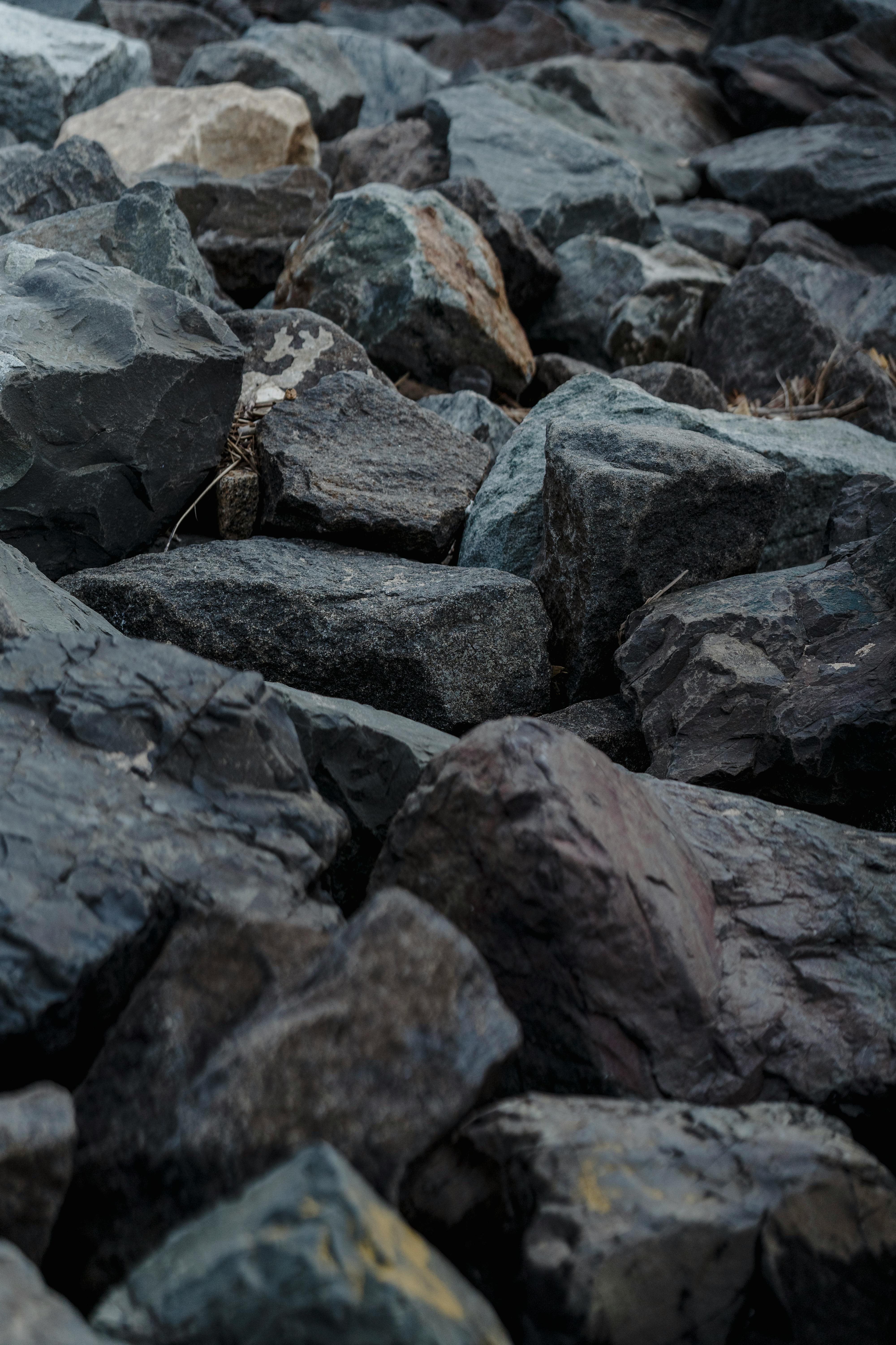 Rough rocks placed in nature in daytime · Free Stock Photo