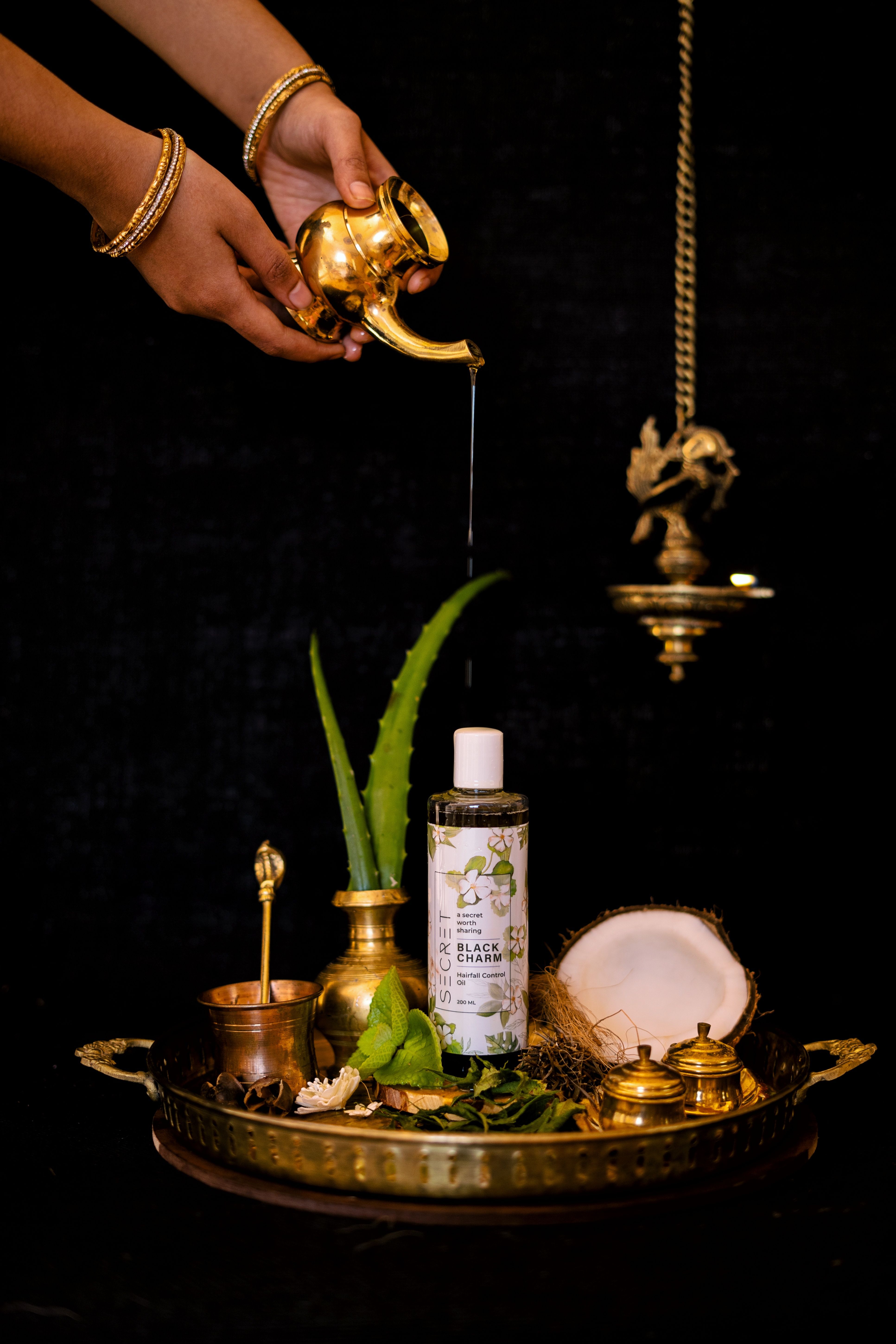 Woman Pouring Liquid on a Tray with a Bottle of Shampoo and Oriental ...