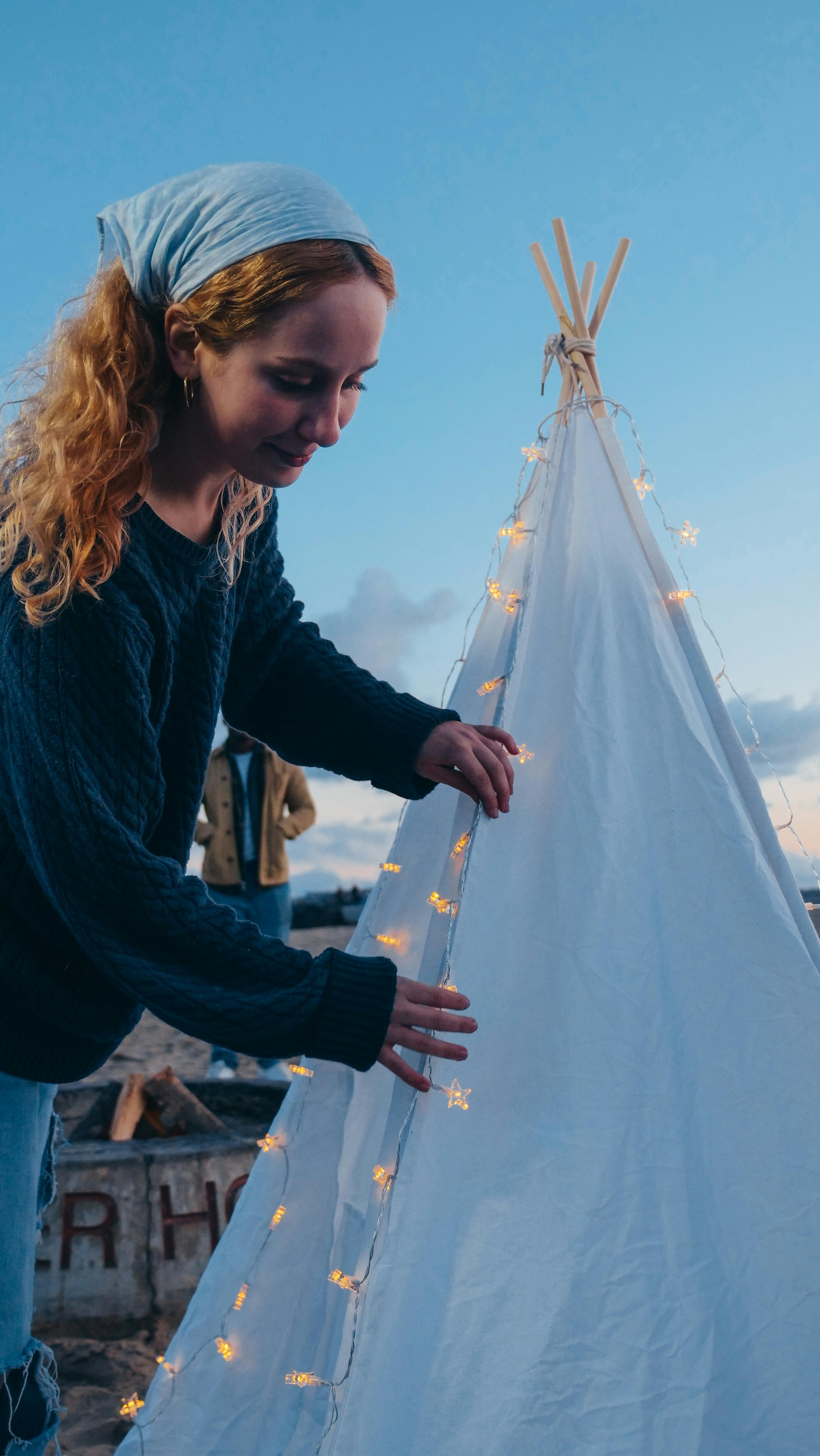 Woman Decorating a Tent · Free Stock Photo