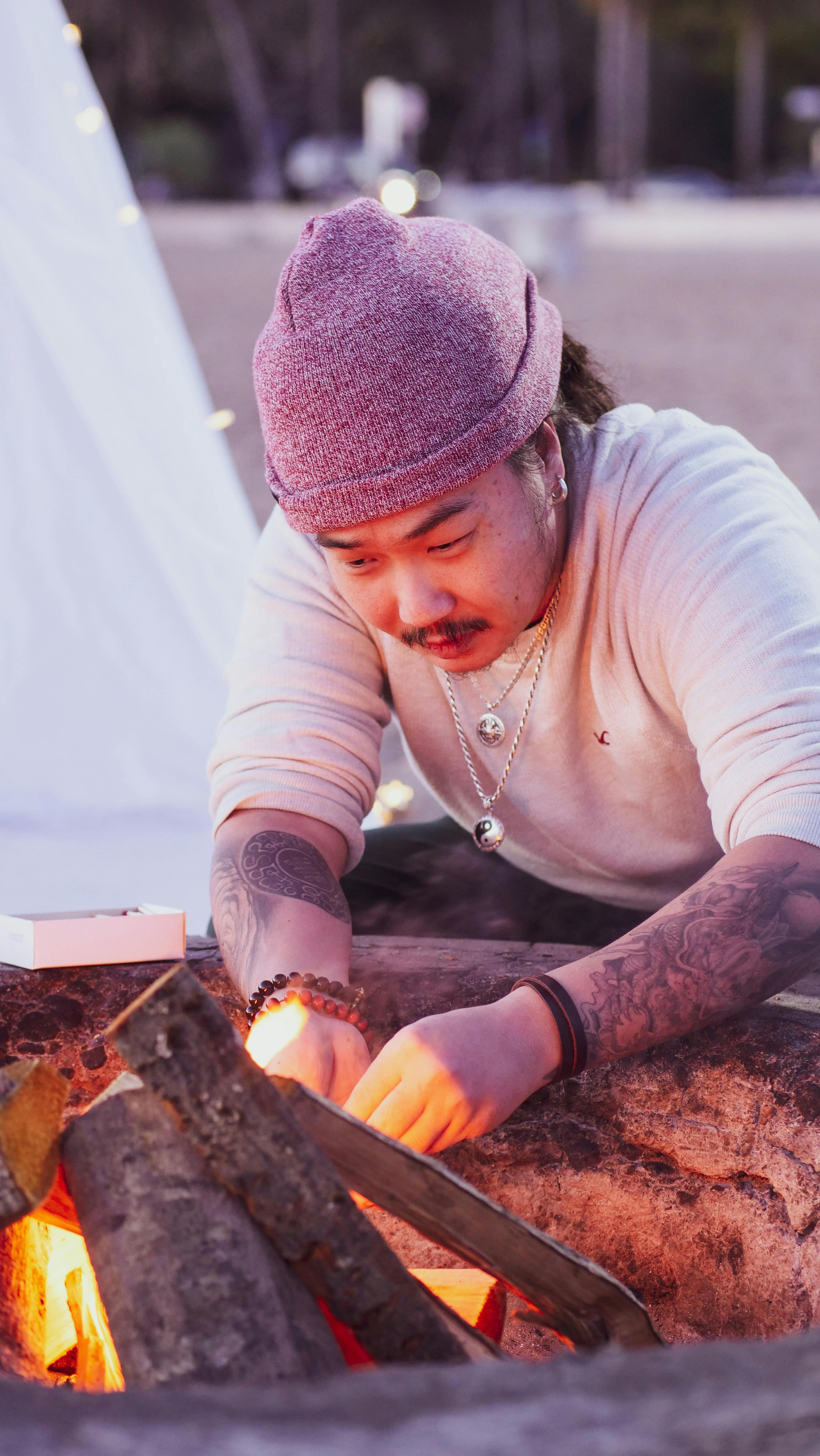 Man Starting a Bonfire · Free Stock Photo
