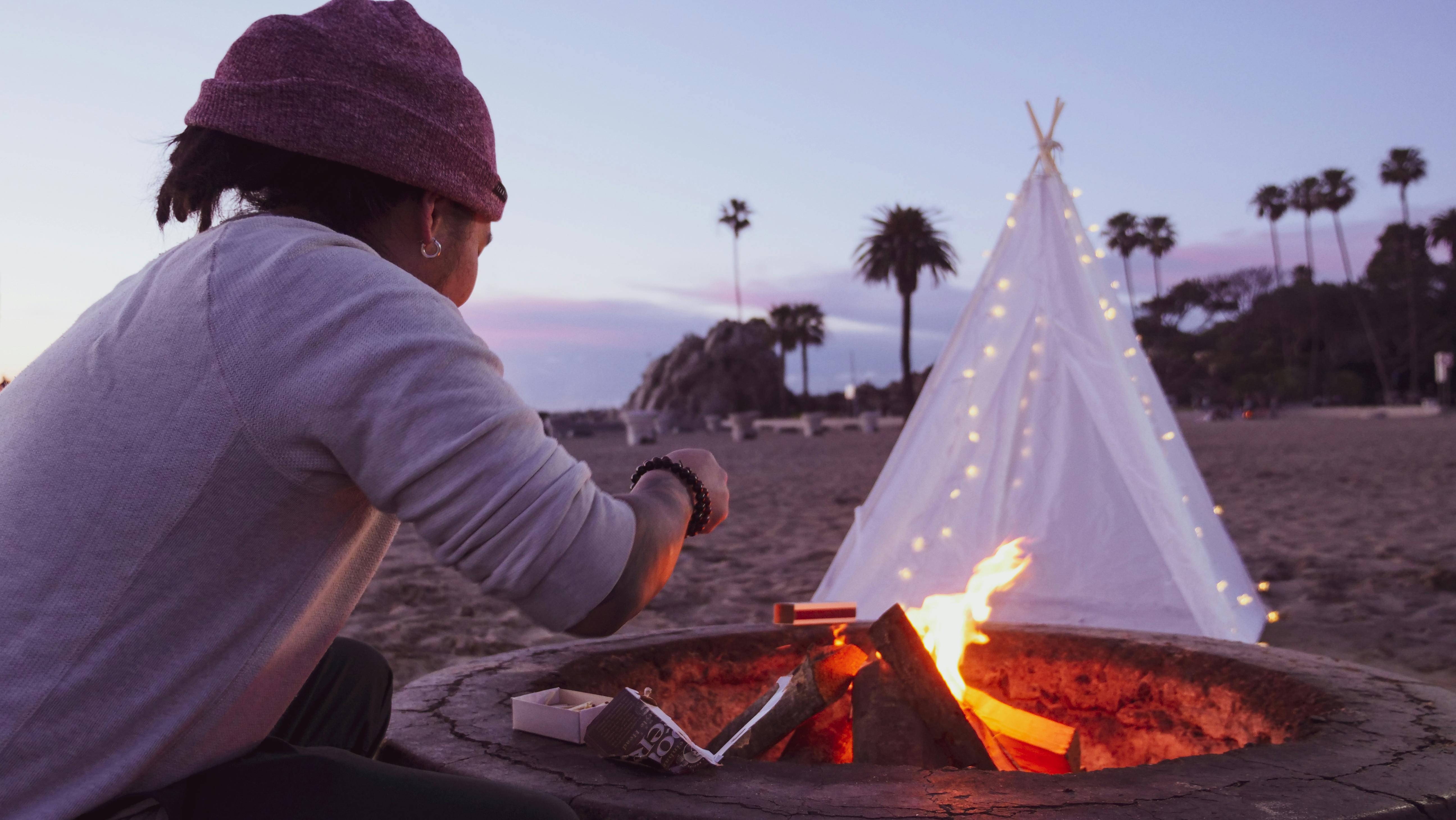 Man Starting a Bonfire · Free Stock Photo