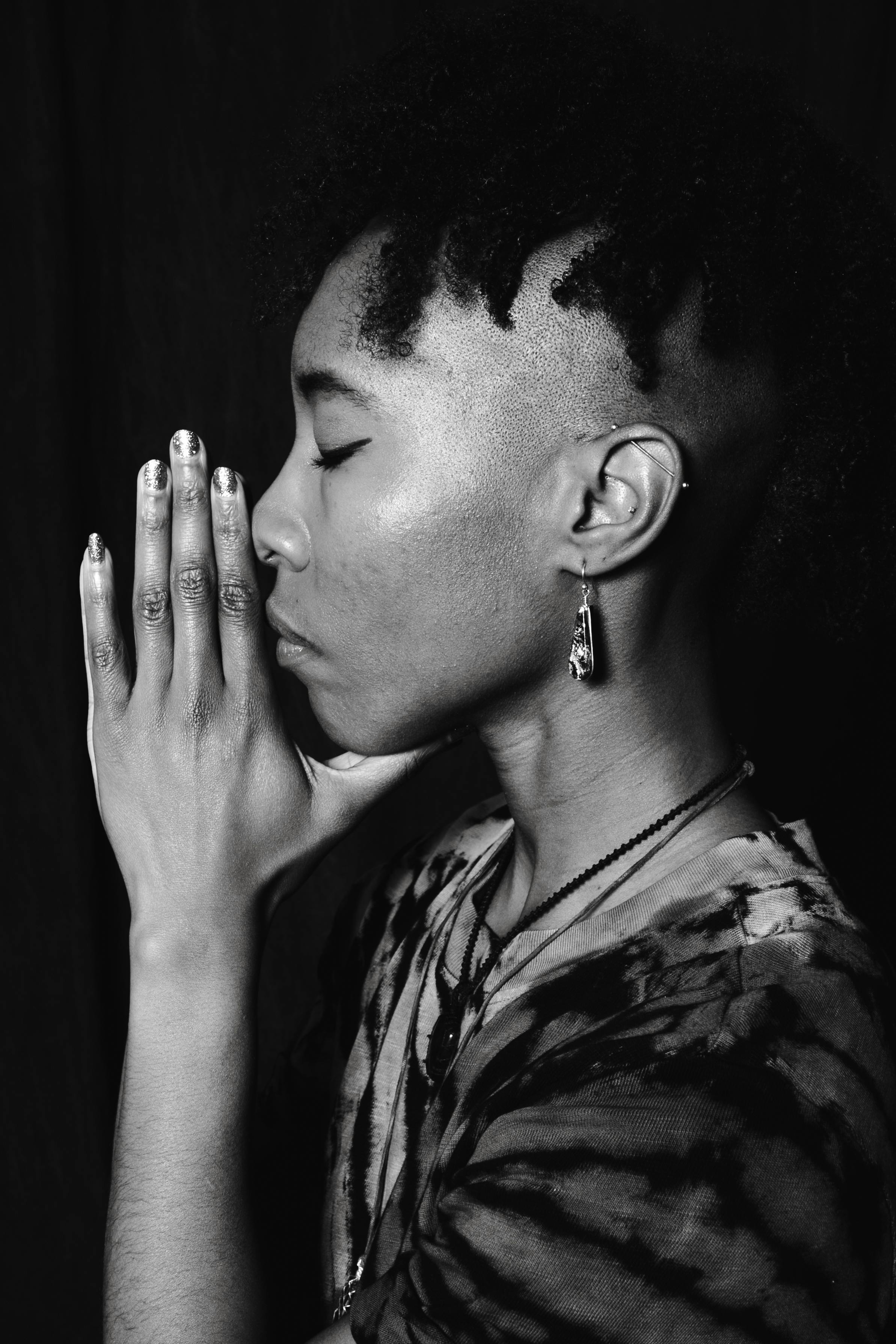 Side Profile of a Woman Praying · Free Stock Photo