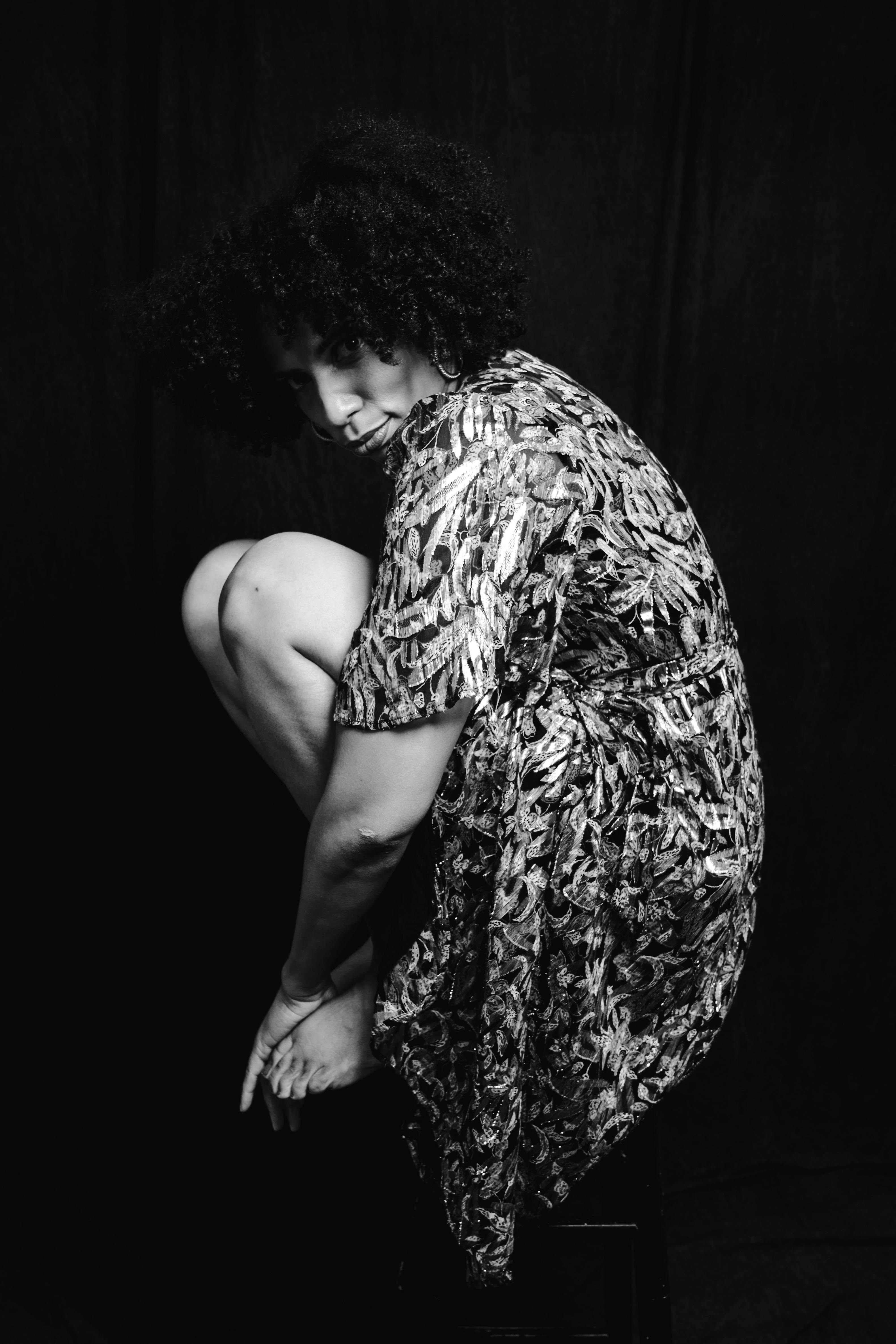 Grayscale Photo of Woman with Afro Hair Posing · Free Stock Photo