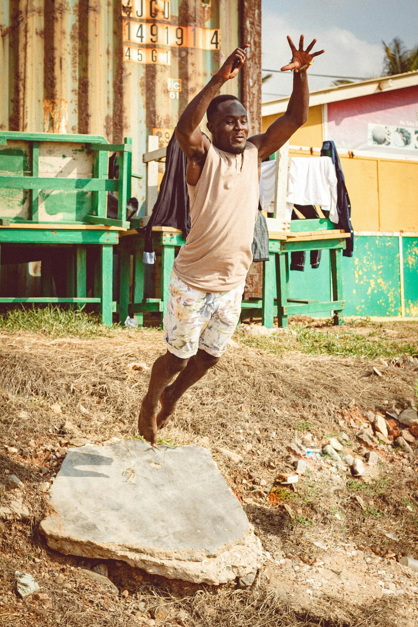 Man Jumping on a Rock at Dawn · Free Stock Photo