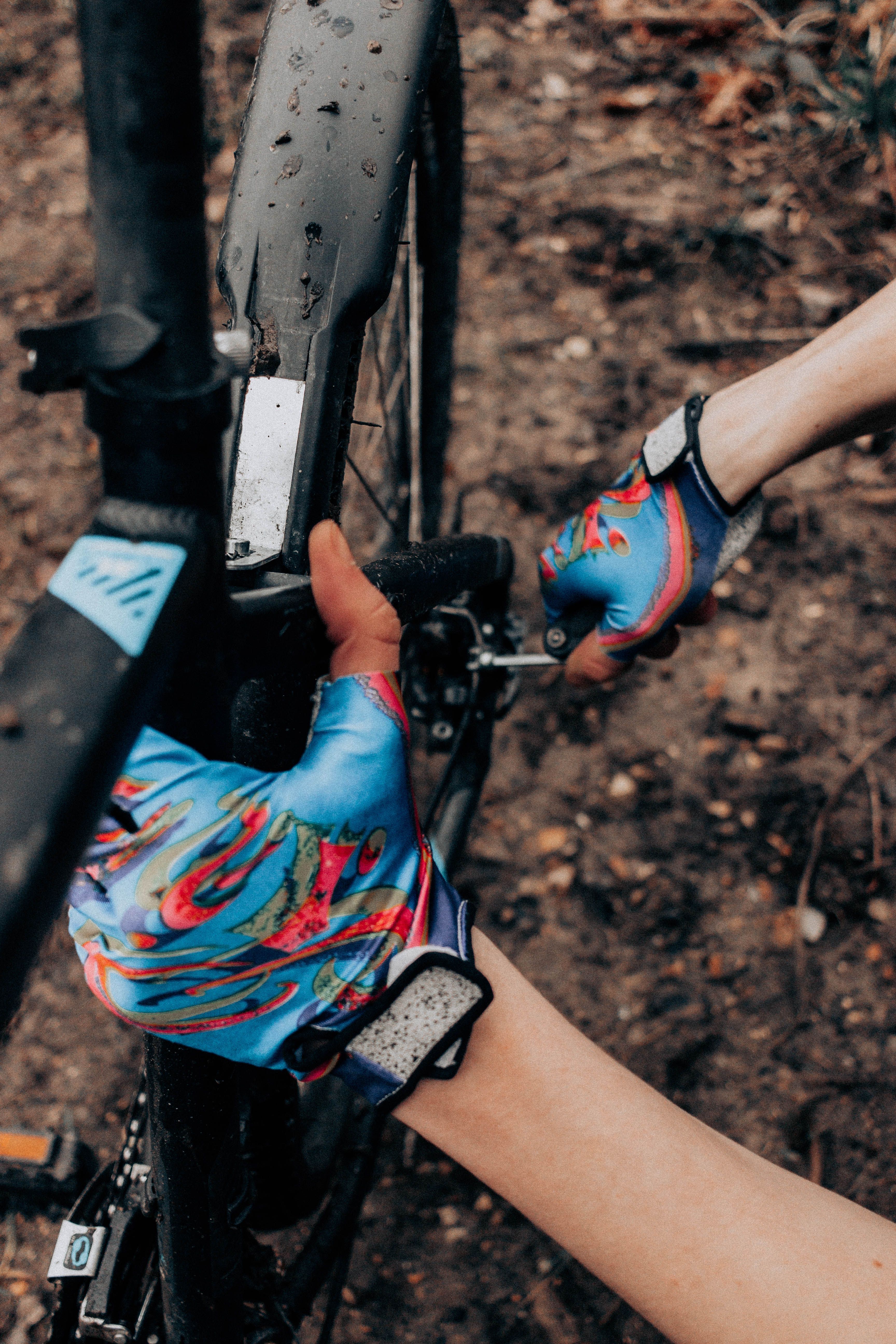 Close-up Photo of Person fixing a Bike · Free Stock Photo