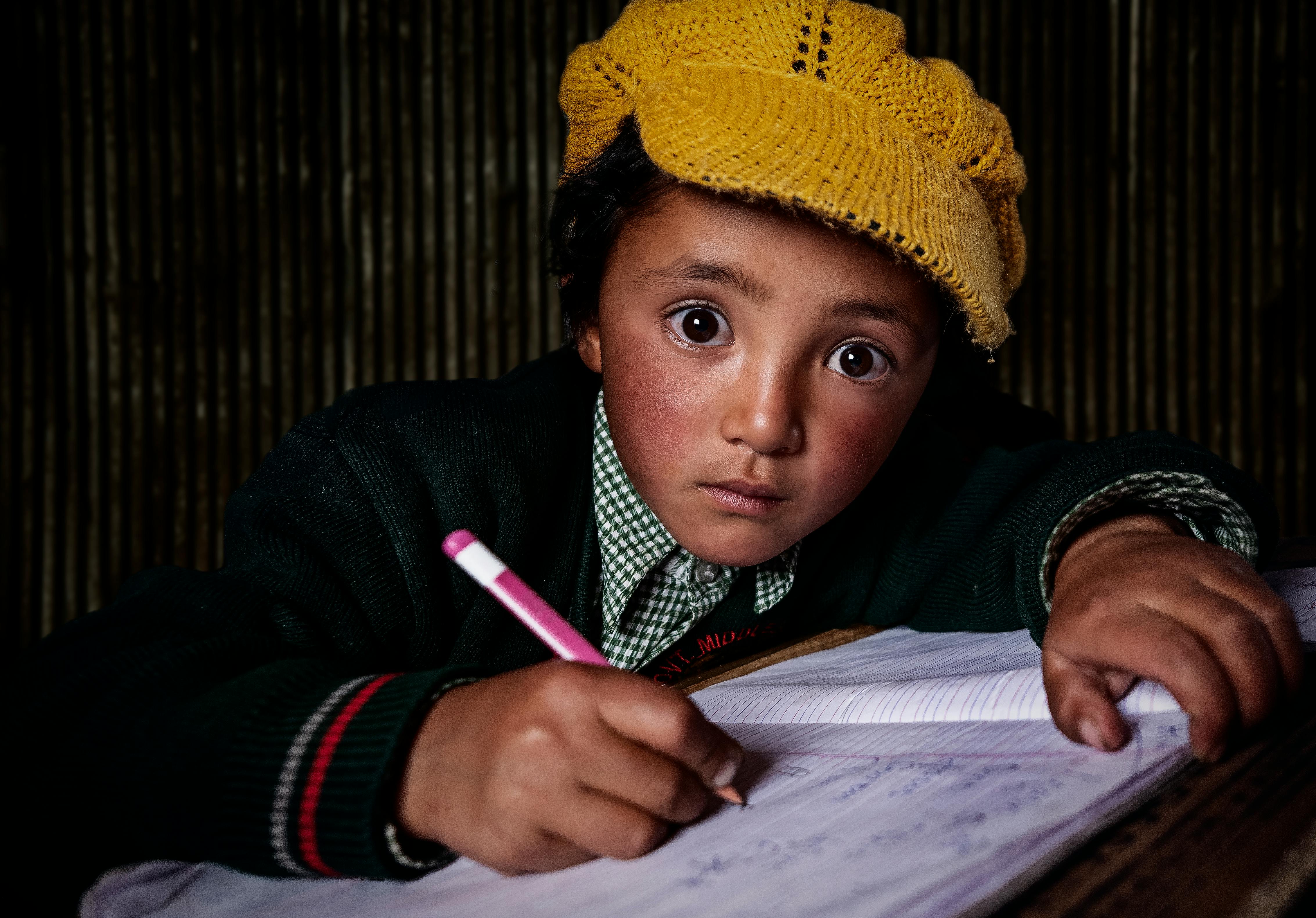 Close-up Photo of Child writing on paper · Free Stock Photo