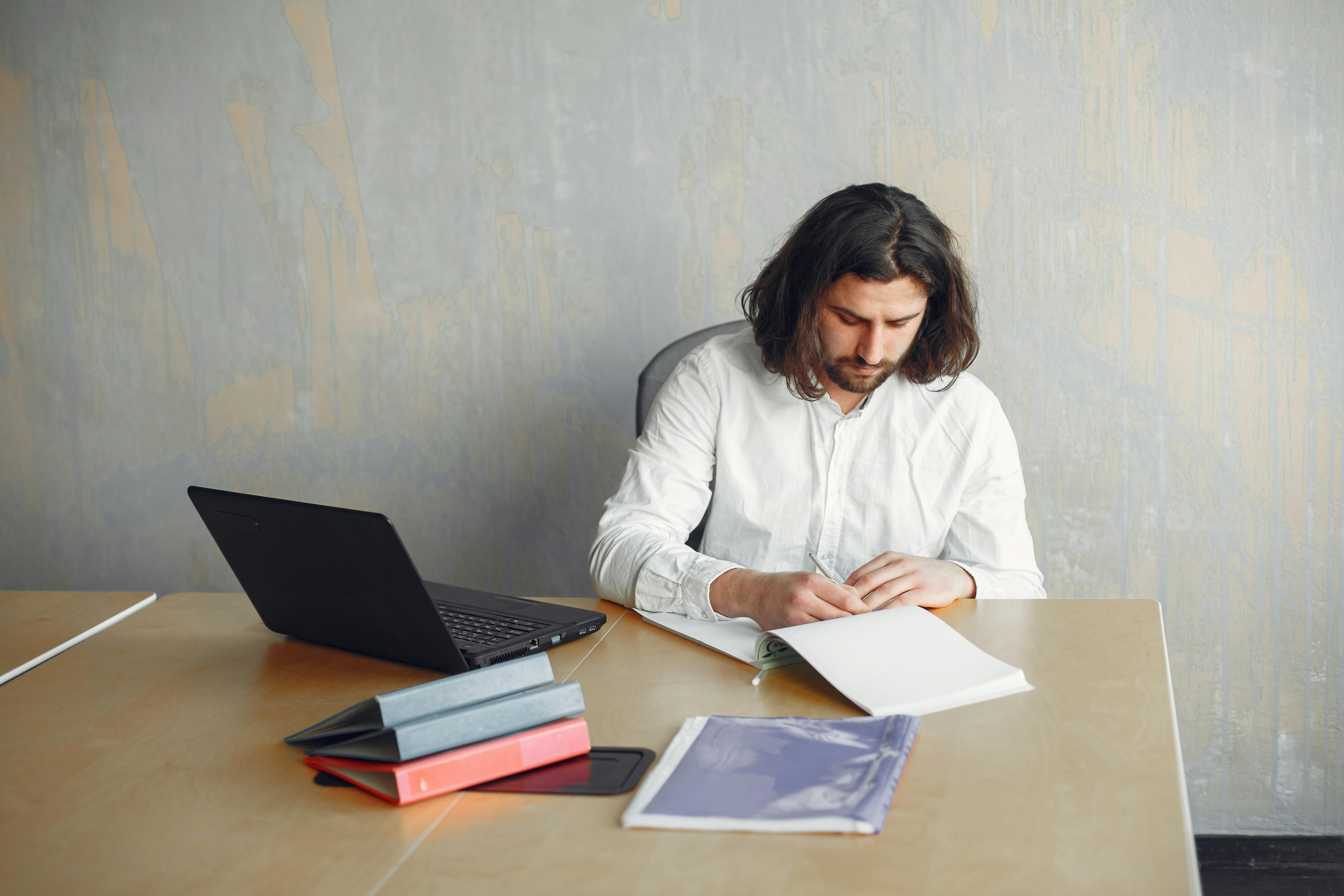 Man doing Paperworks · Free Stock Photo