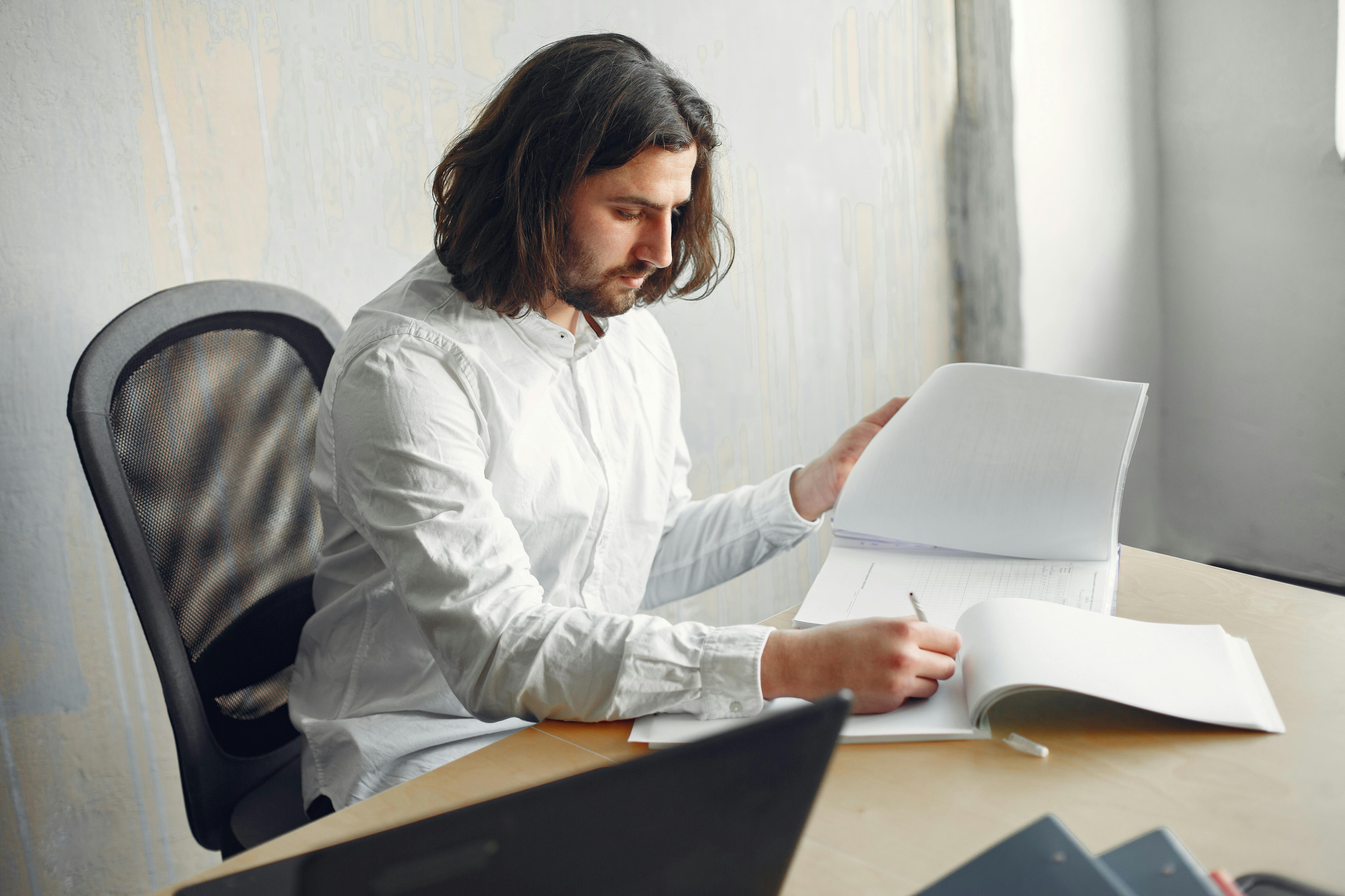Man doing Paperworks · Free Stock Photo