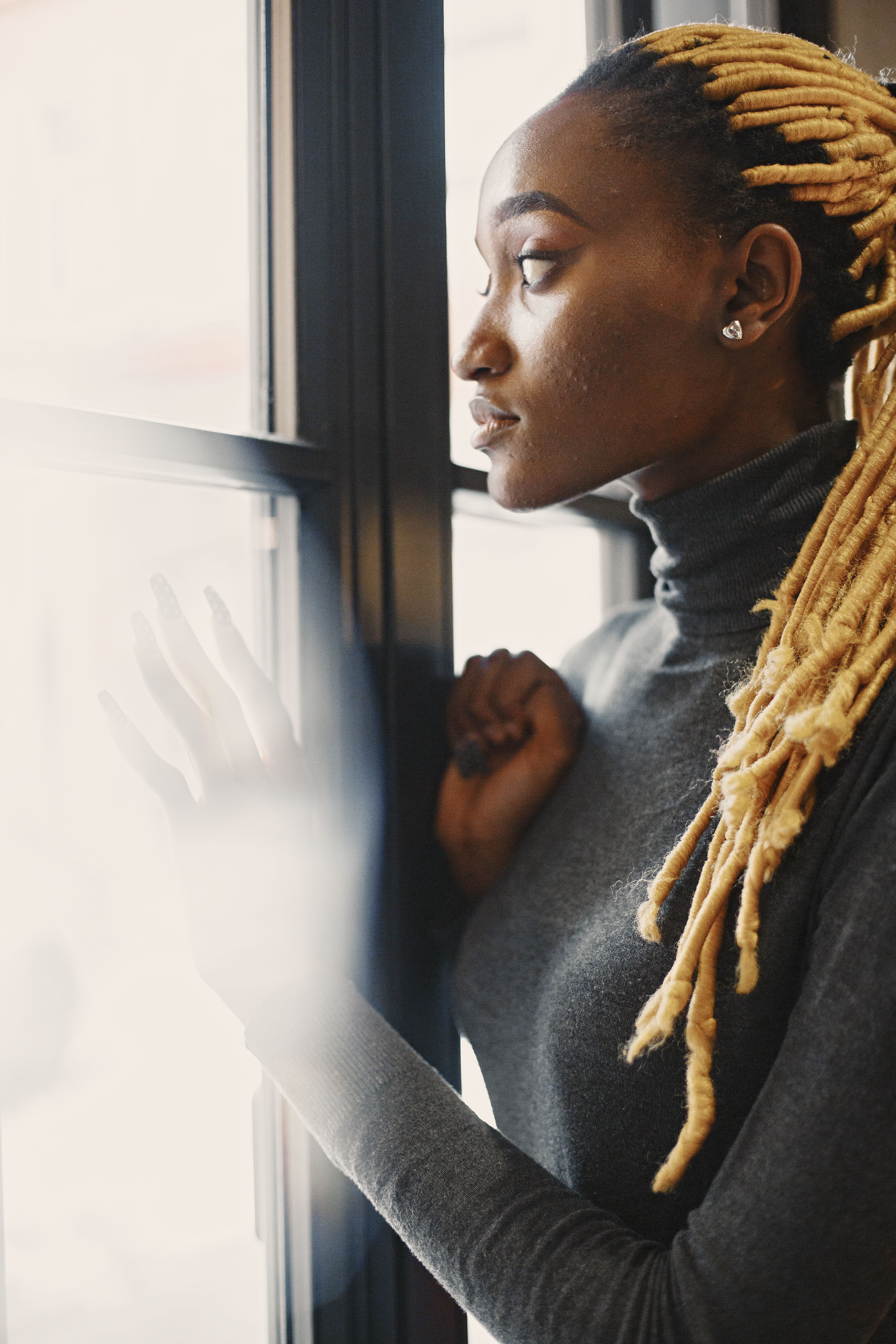 Woman Hiding behind a Newspaper · Free Stock Photo