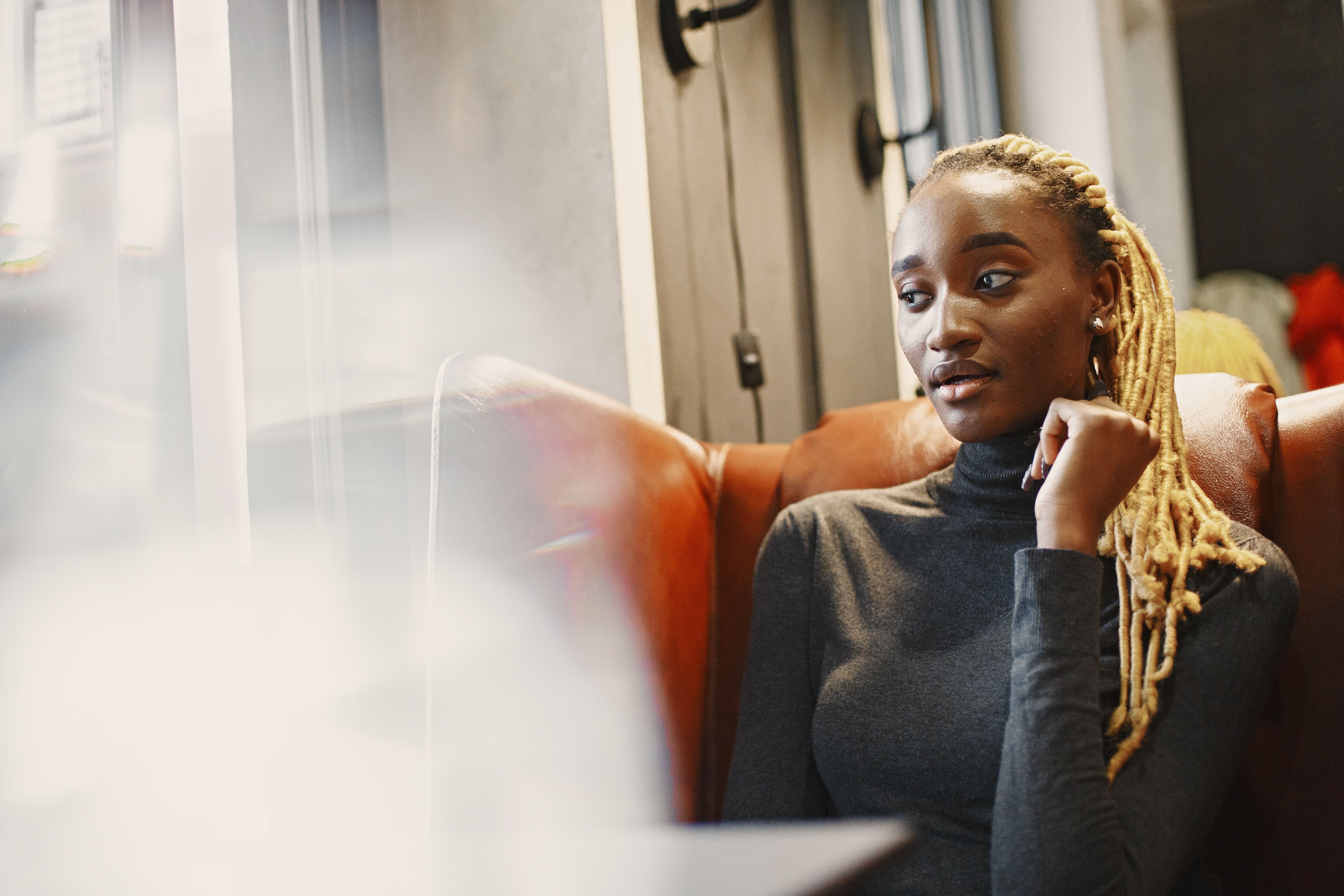Woman Hiding behind a Newspaper · Free Stock Photo