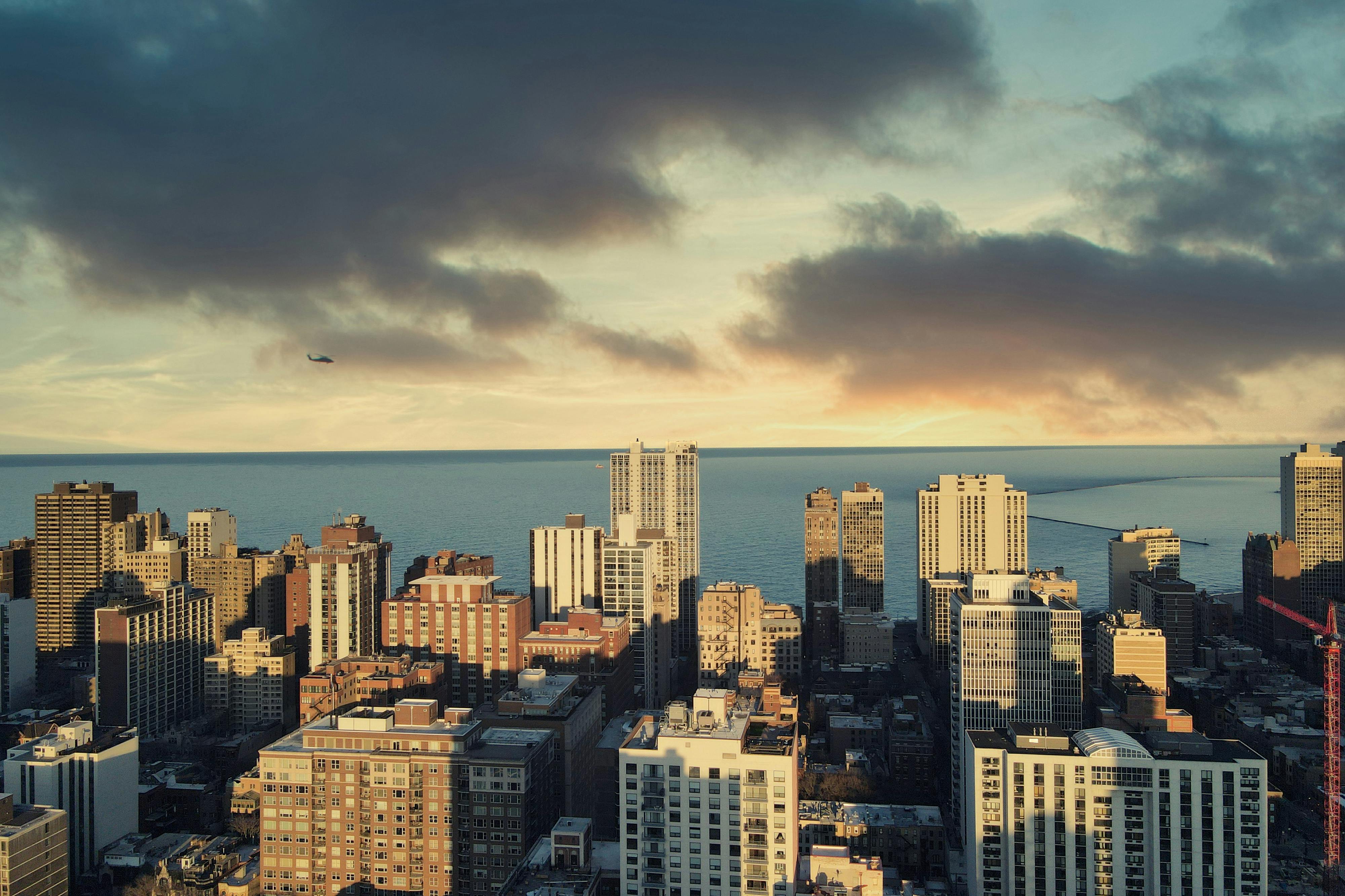 Body Of Water Near High-rise Buildings · Free Stock Photo
