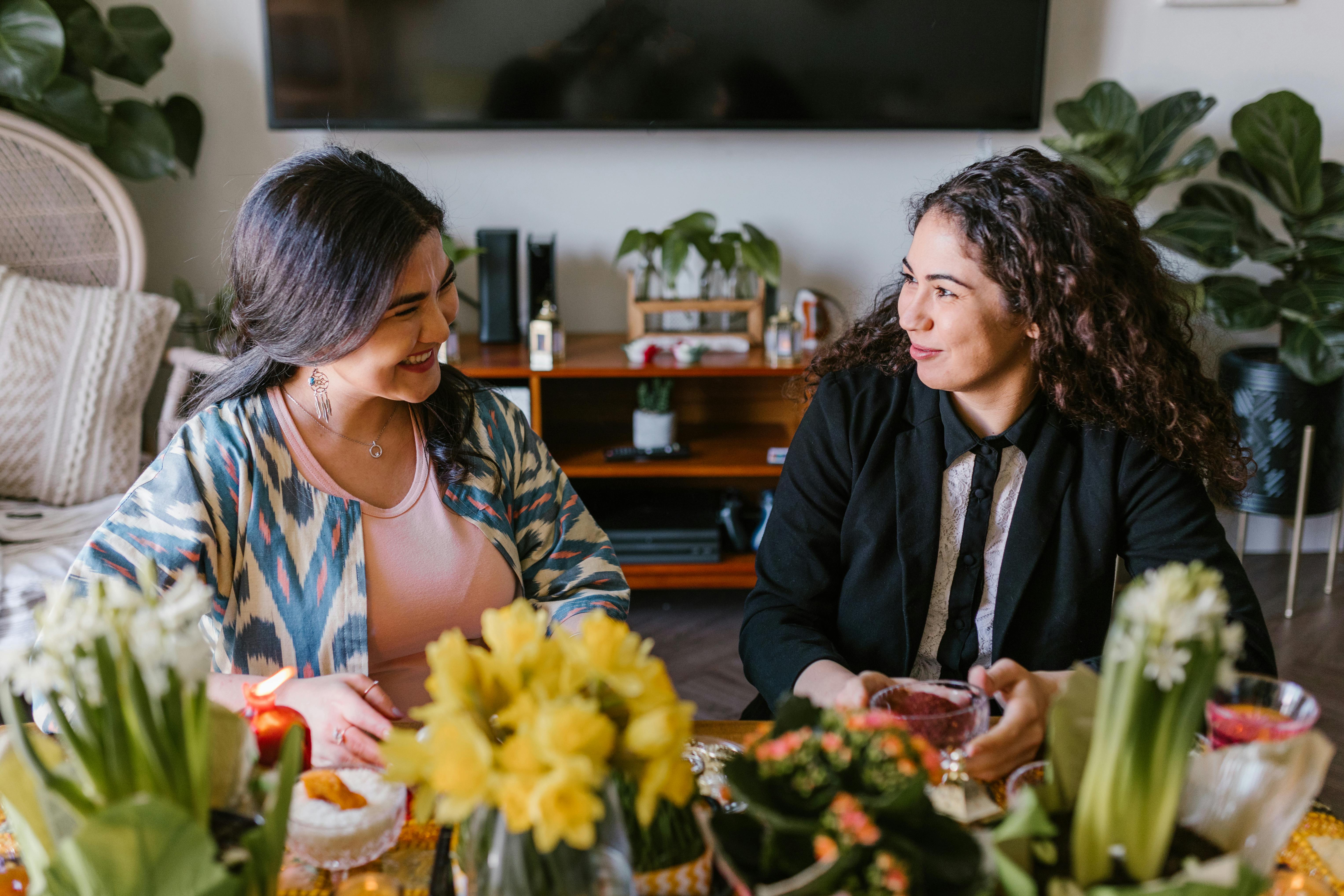 Two Women Sitting By The Table · Free Stock Photo