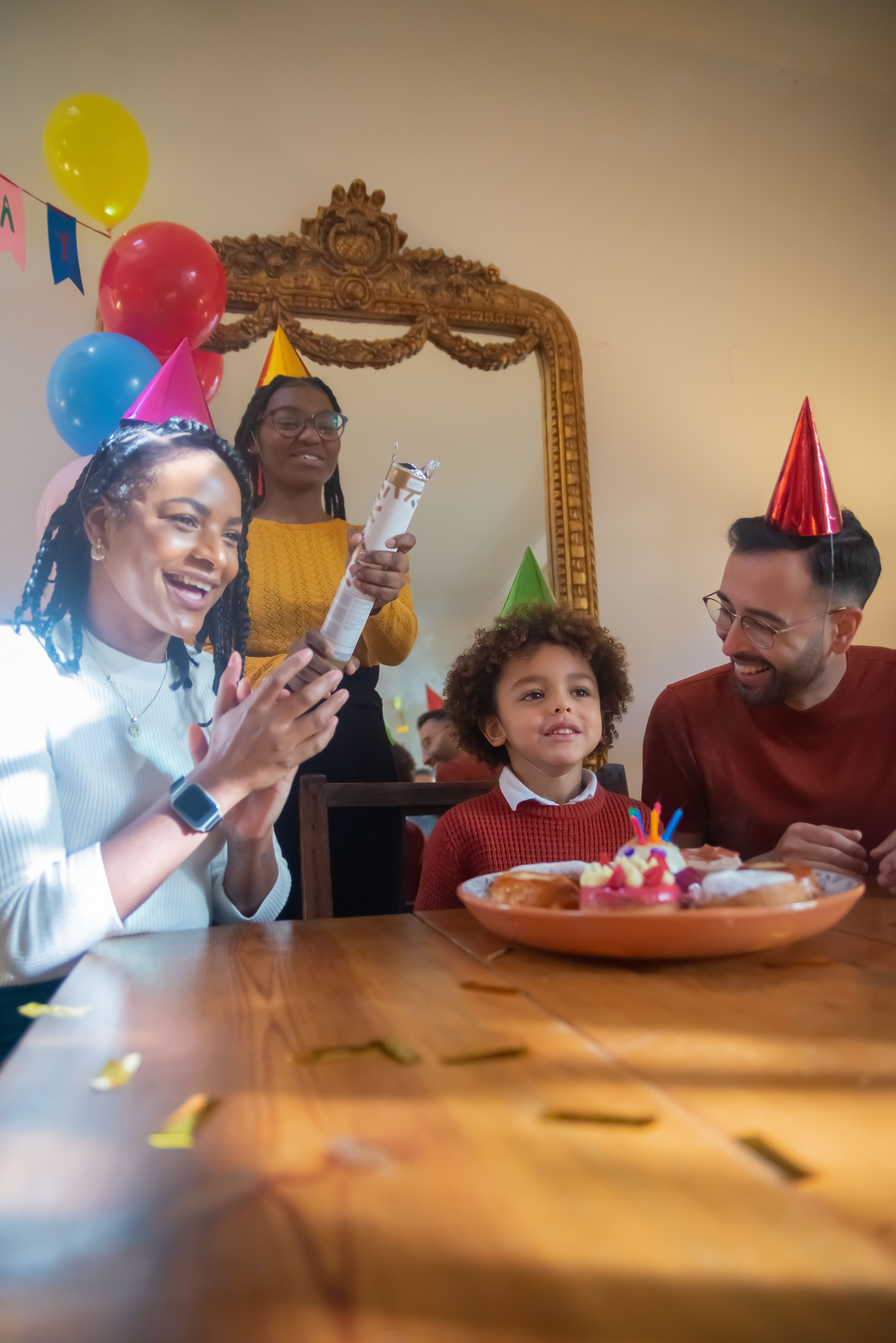 A Family Sitting at the Table · Free Stock Photo