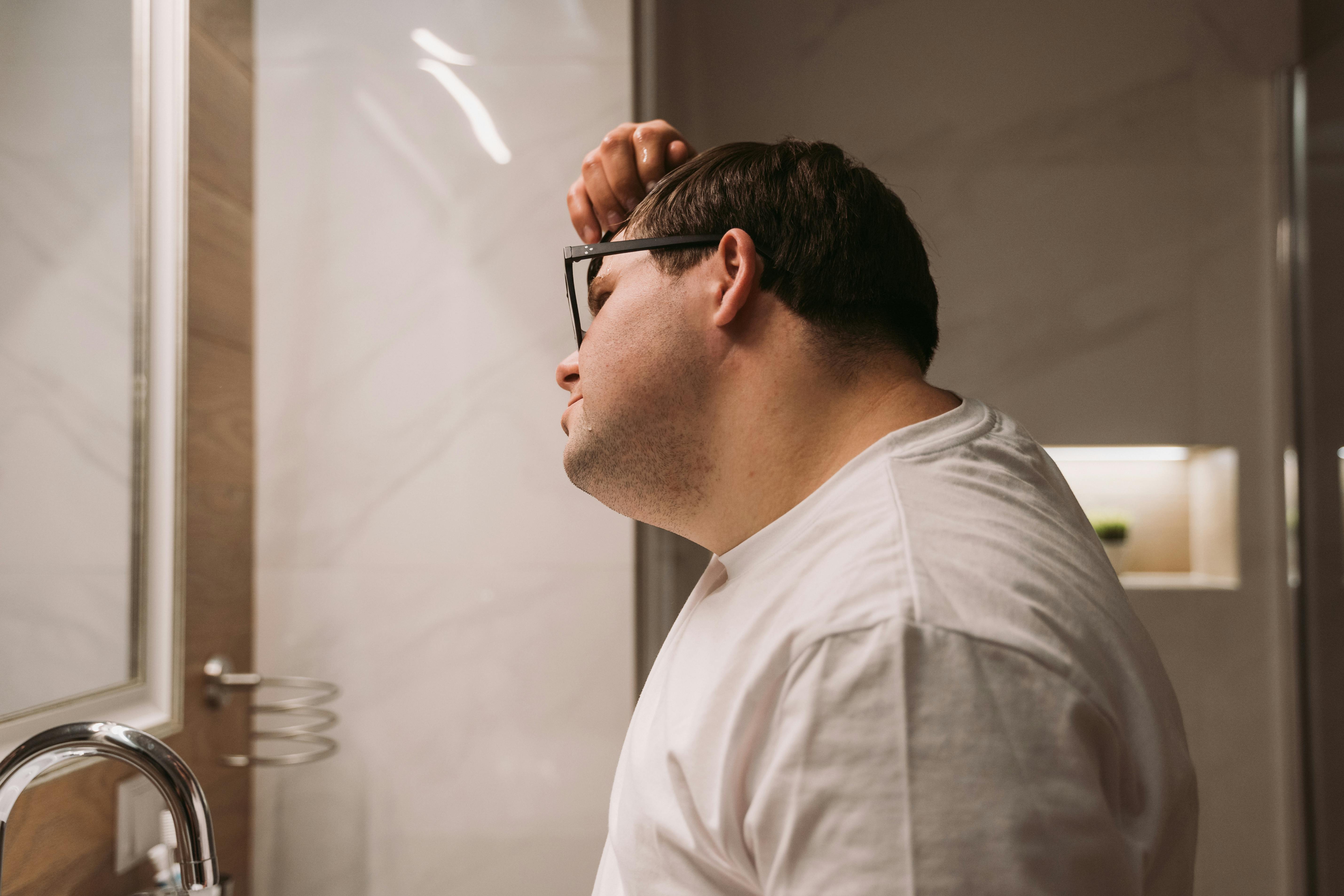 Man Looking at a Mirror · Free Stock Photo
