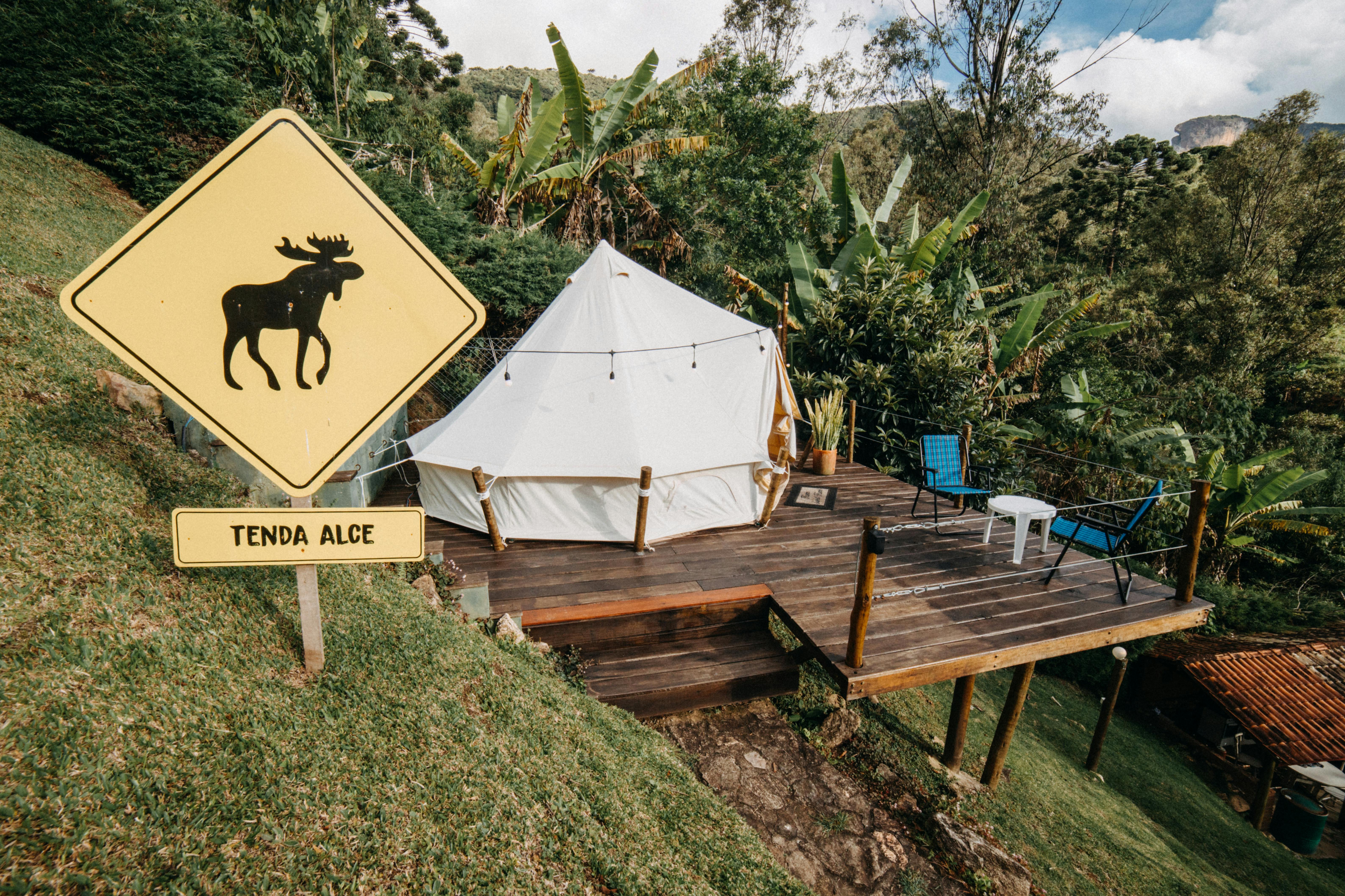 Tent on terrace amidst trees · Free Stock Photo