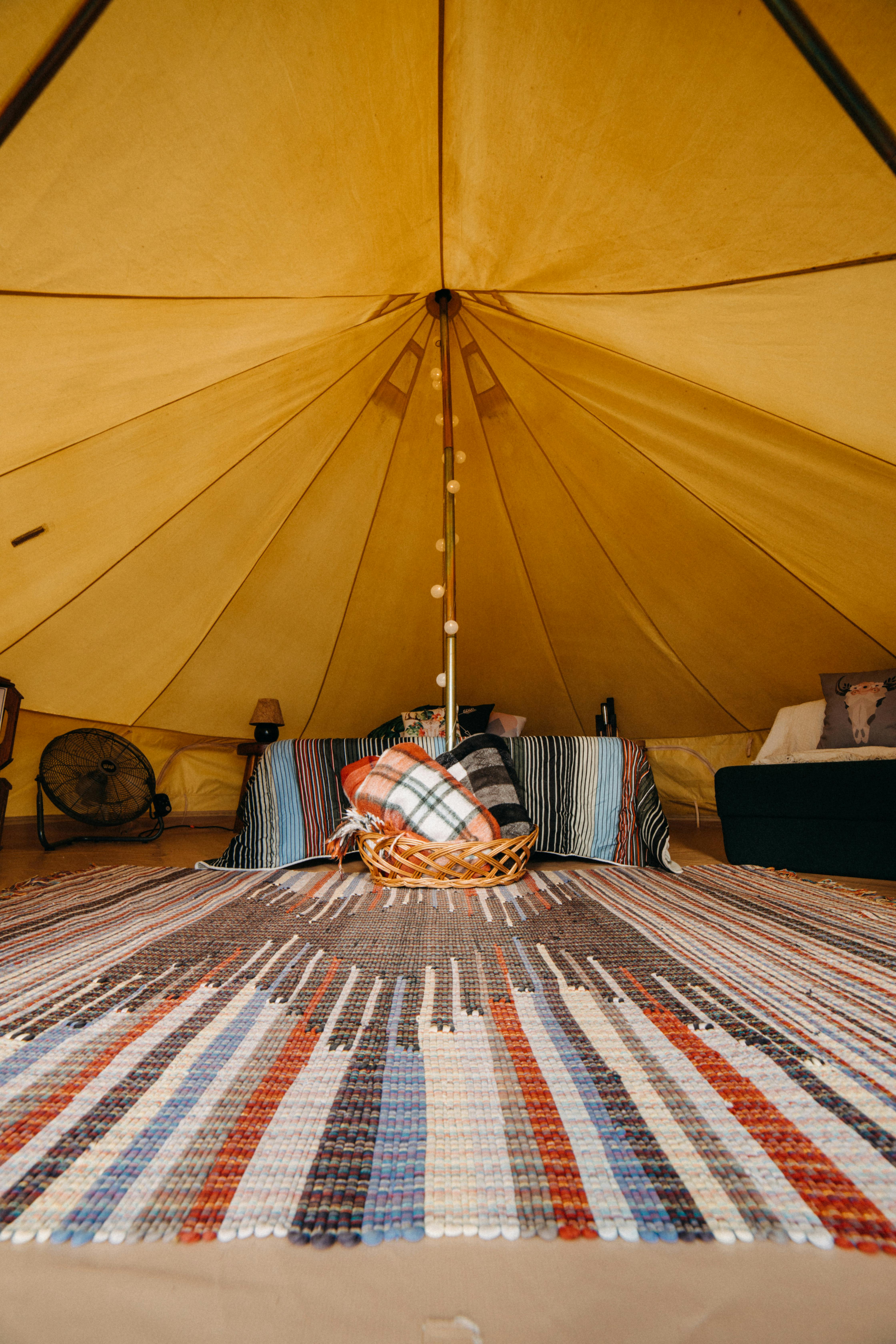 Tent with colorful rug in countryside · Free Stock Photo