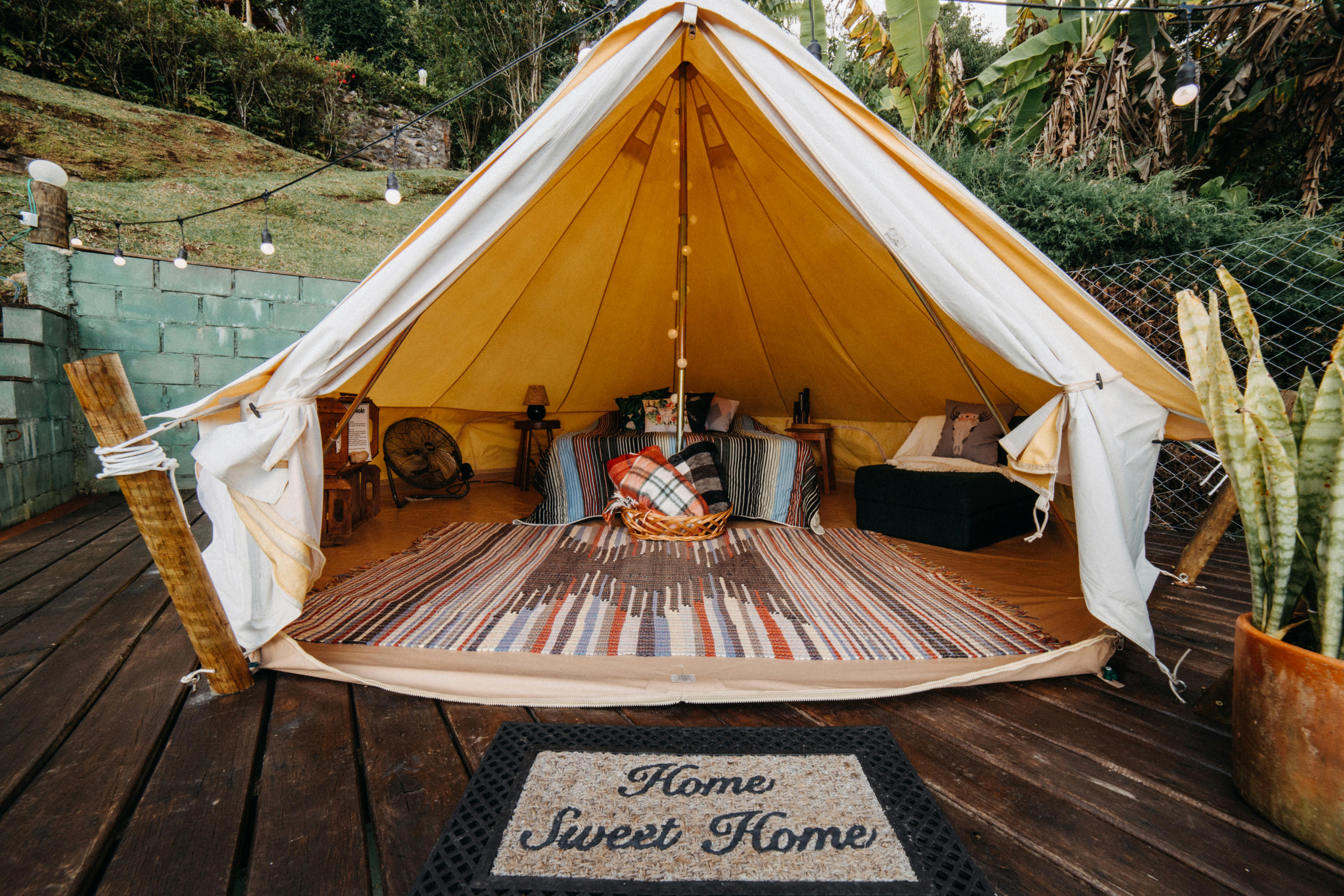 Tent on wooden terrace in countryside · Free Stock Photo