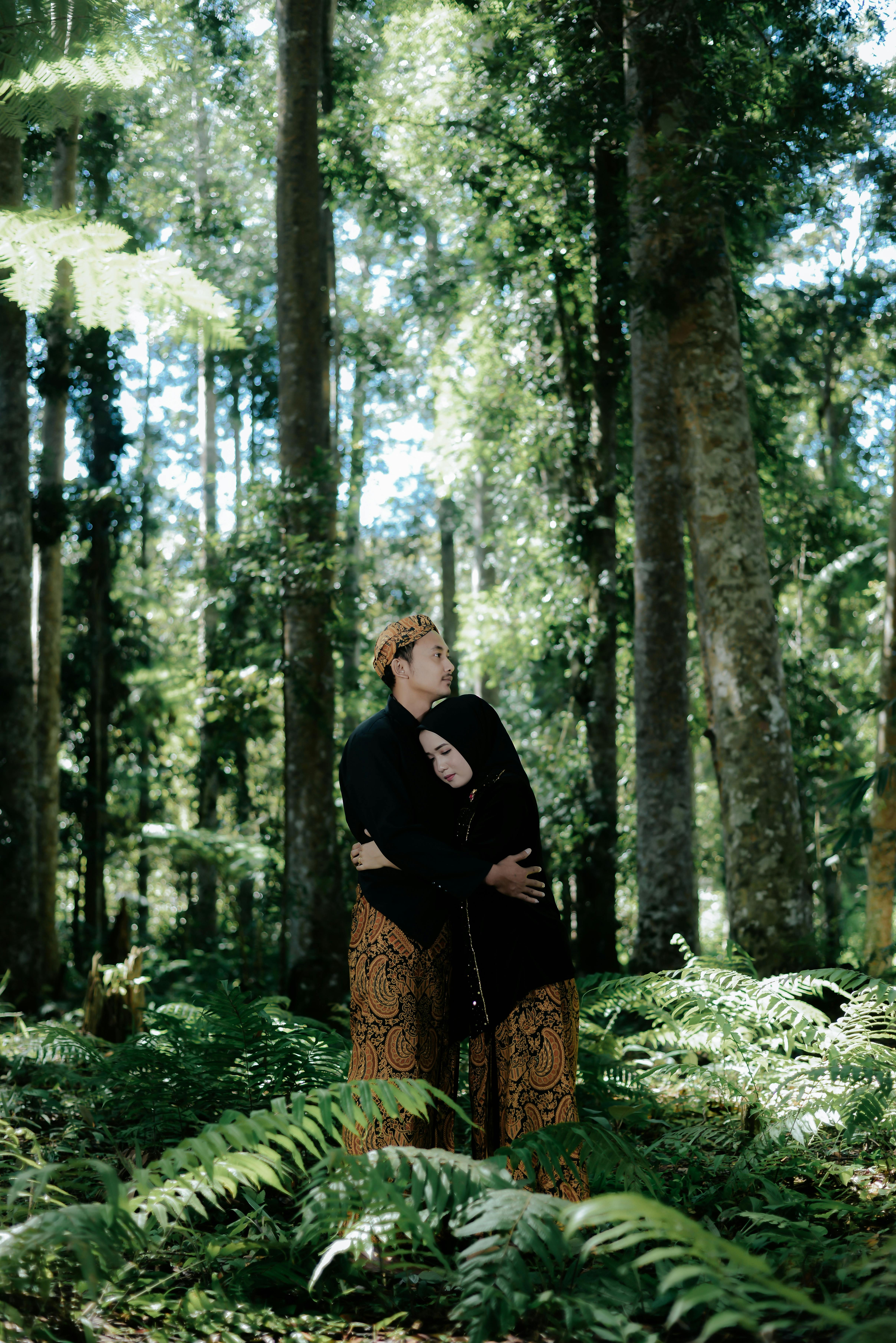 A Romantic Couple Hugging in the Forest · Free Stock Photo