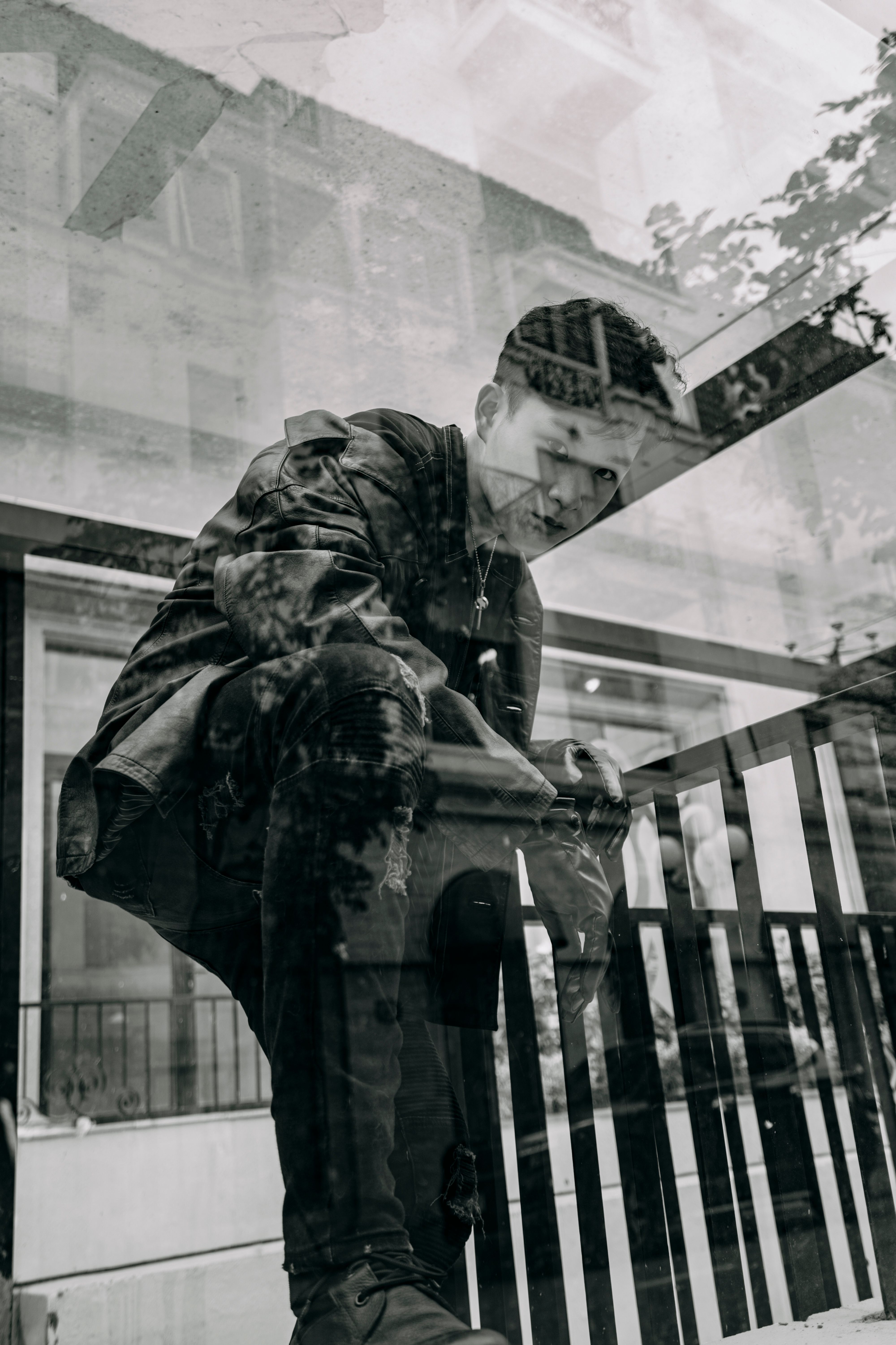 Through glass of Asian man on street · Free Stock Photo