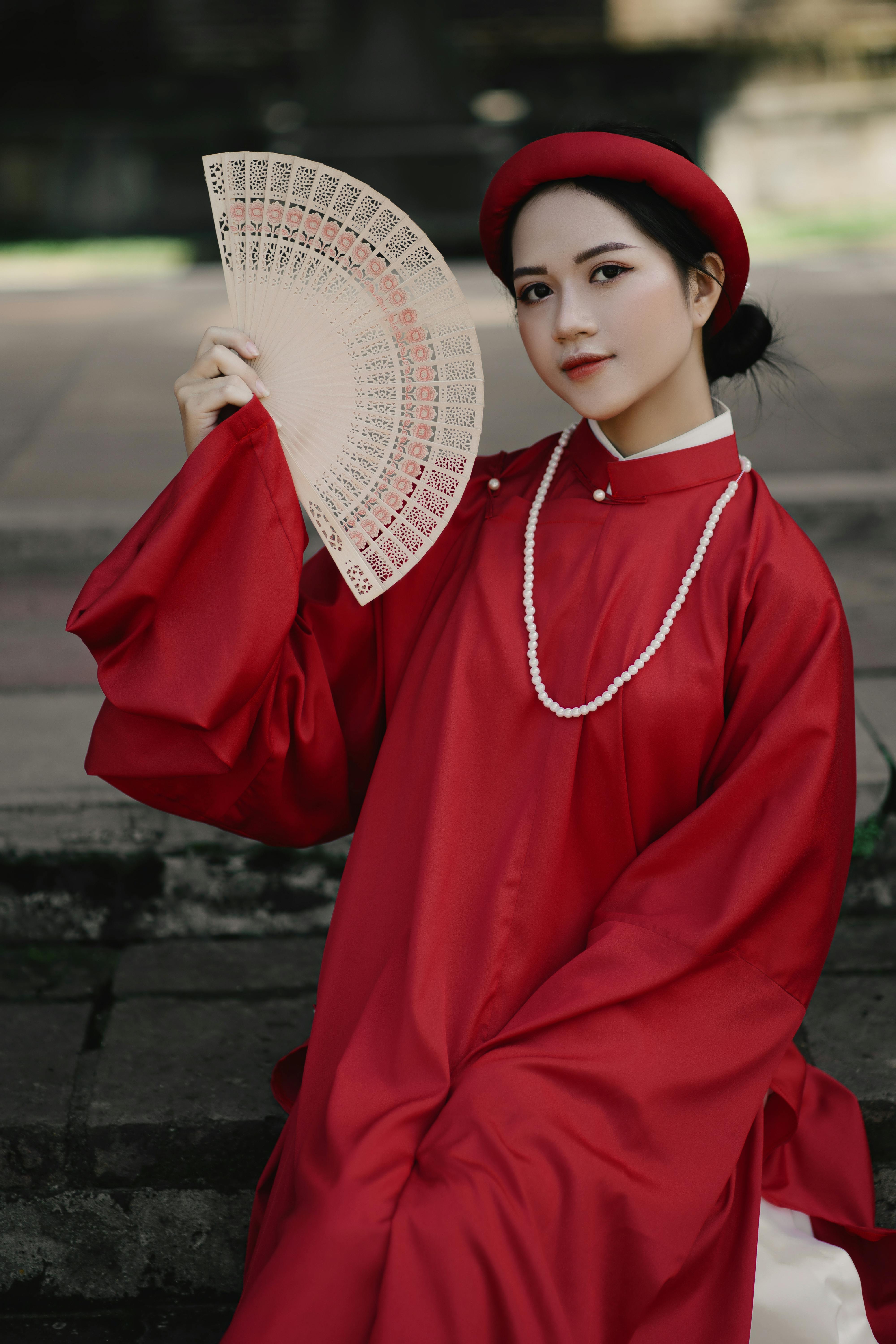 Woman Wearing Traditional Clothing and Holding Fan · Free Stock Photo
