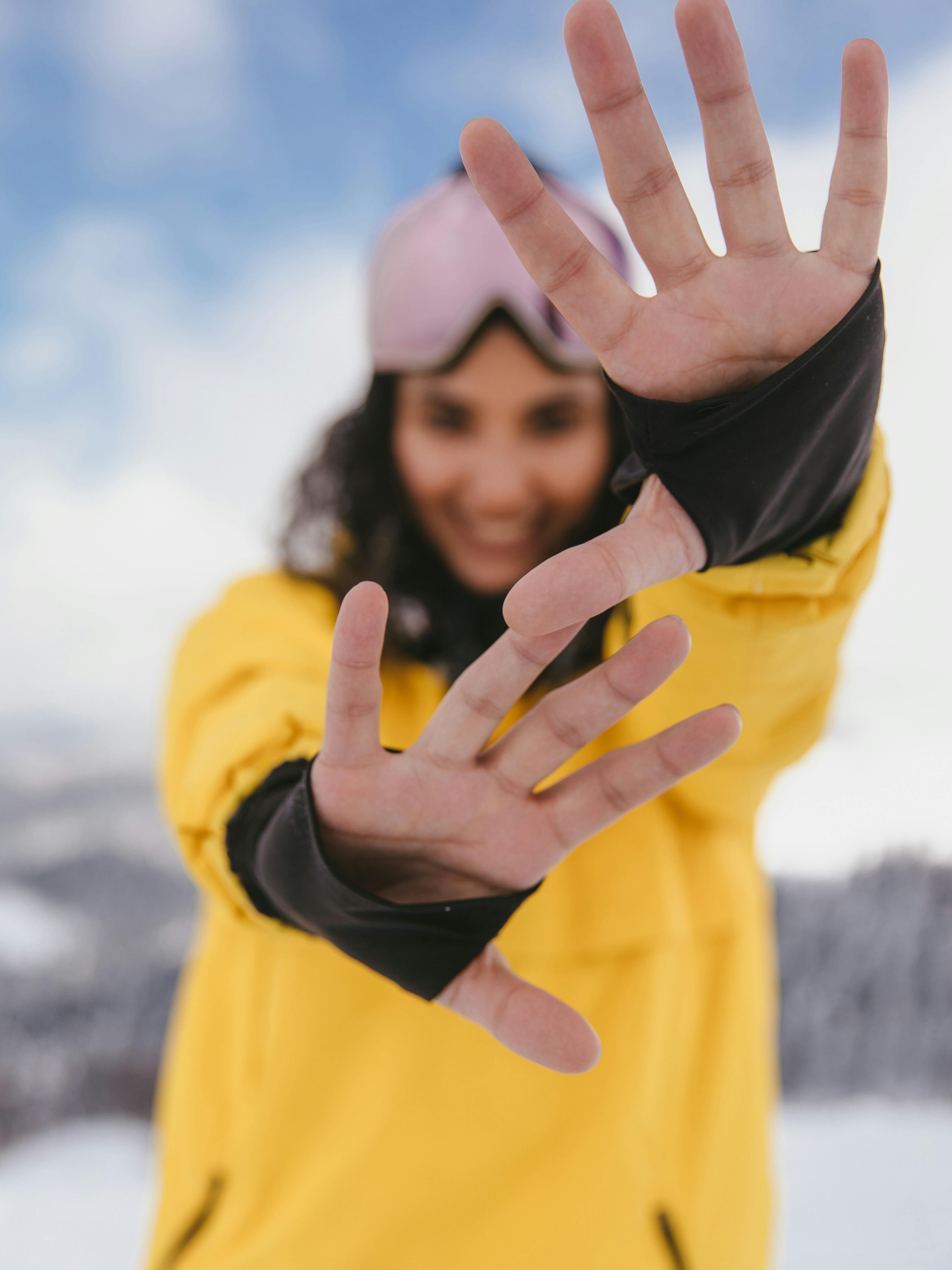 A Woman in Yellow Jacket Showing Her Hands · Free Stock Photo
