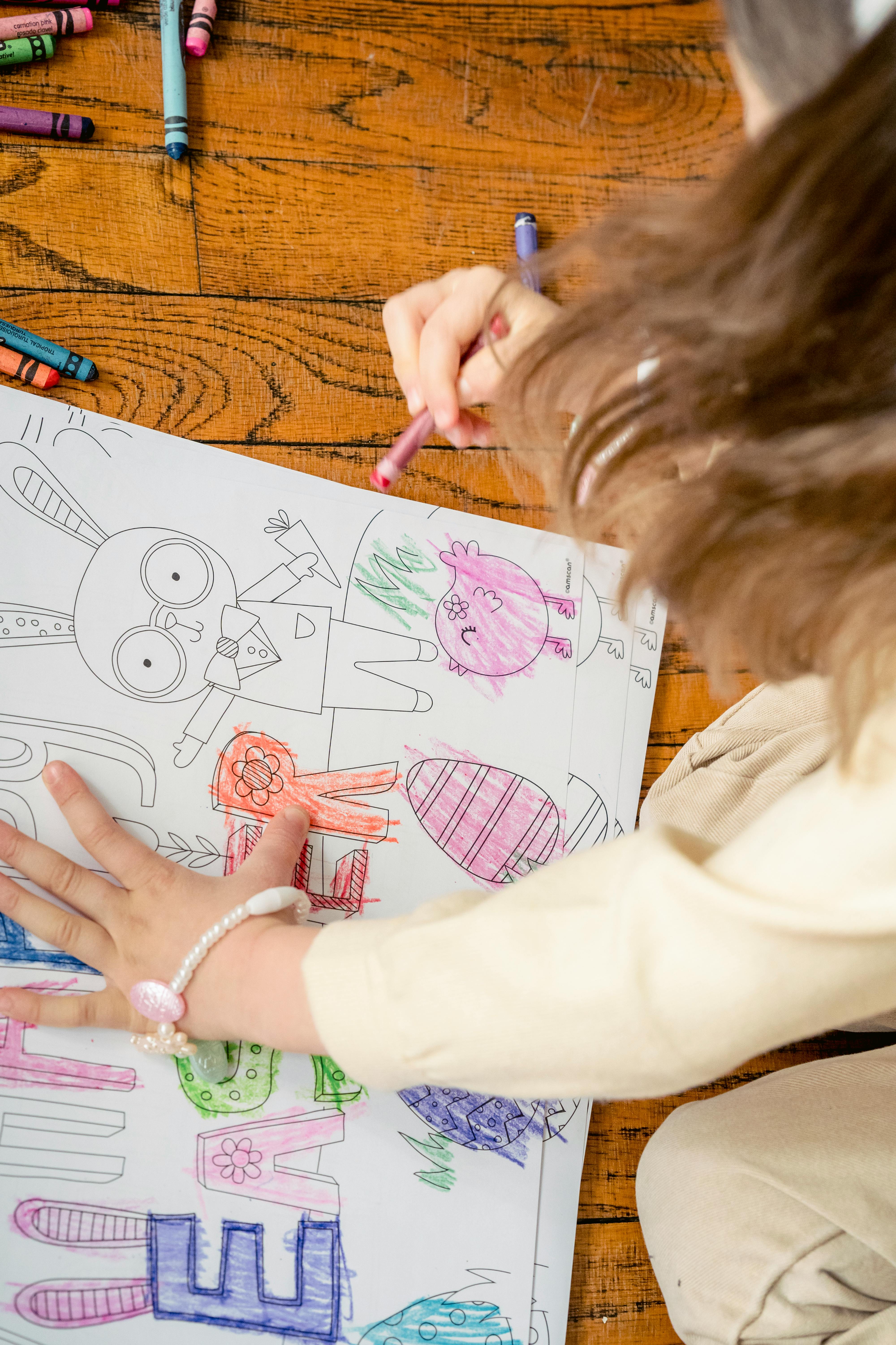 Little child sitting on floor and drawing · Free Stock Photo