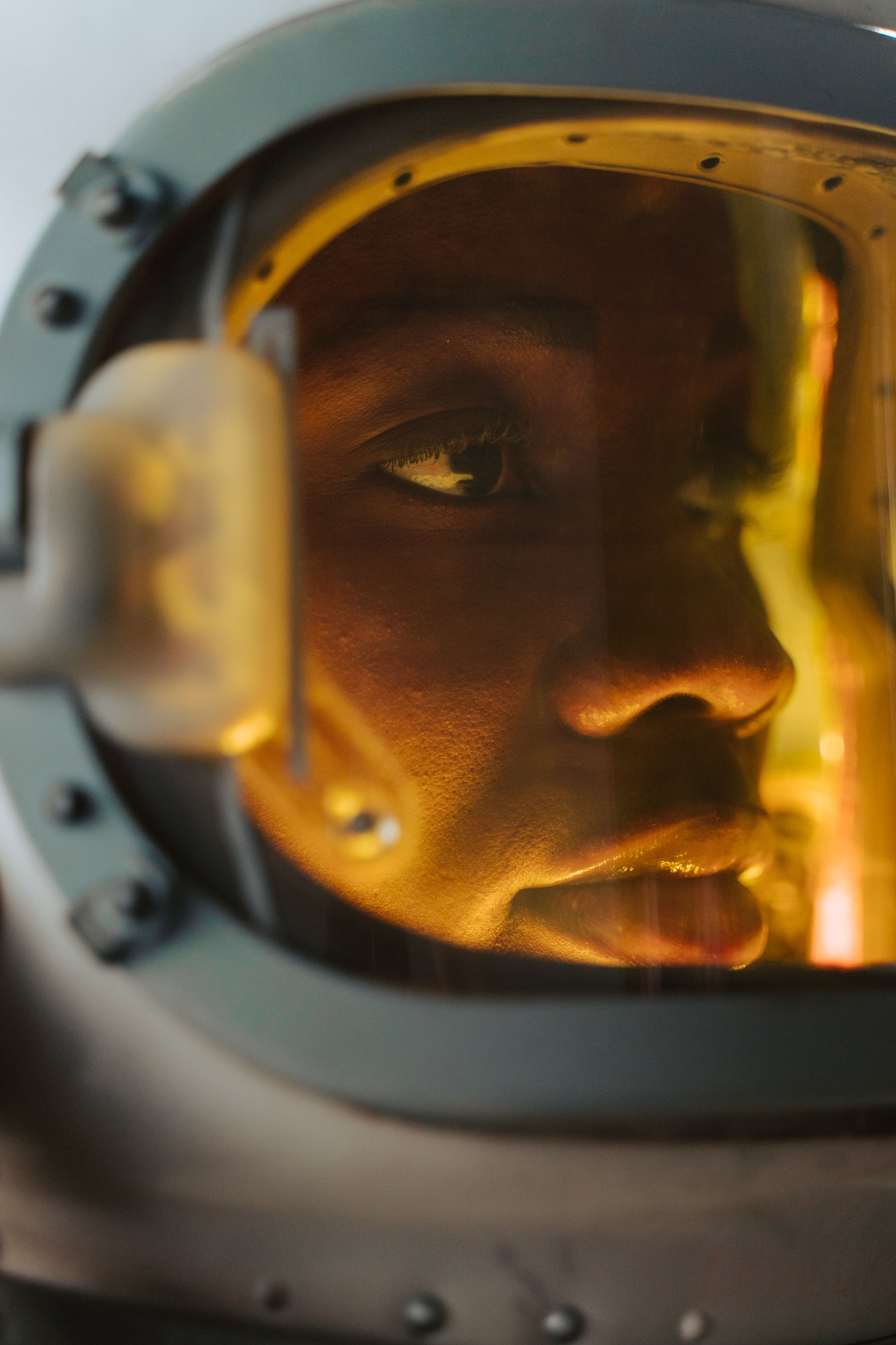 Person Wearing Space Helmet with Orange Light · Free Stock Photo