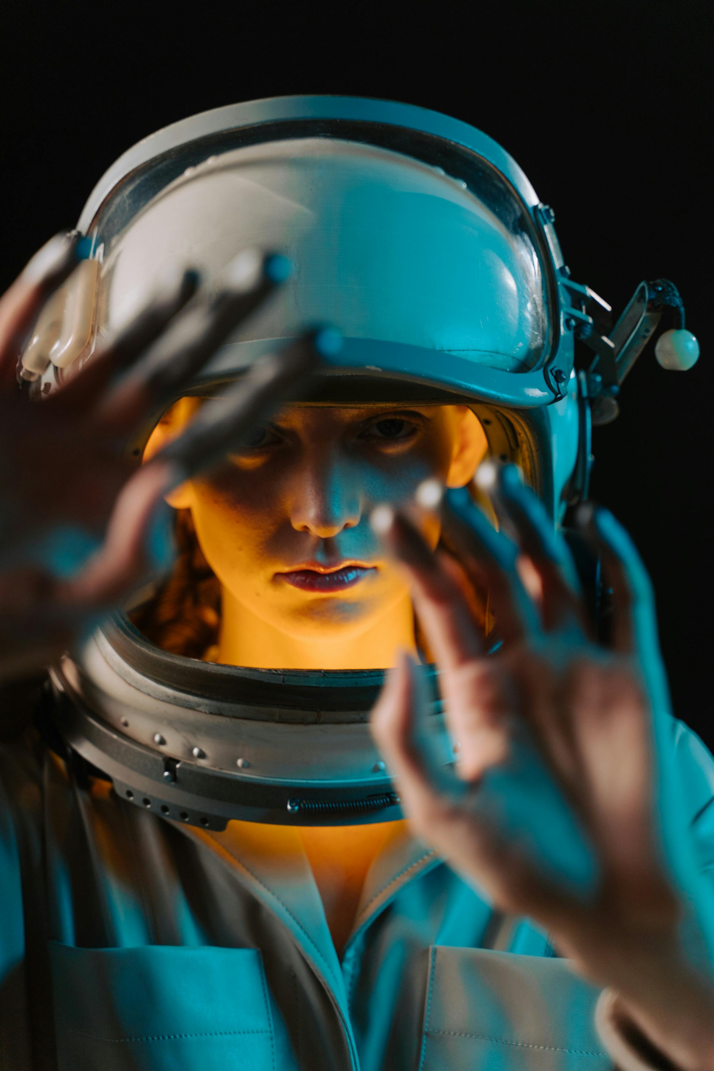 Woman in an Astronaut Uniform Covering her Face · Free Stock Photo