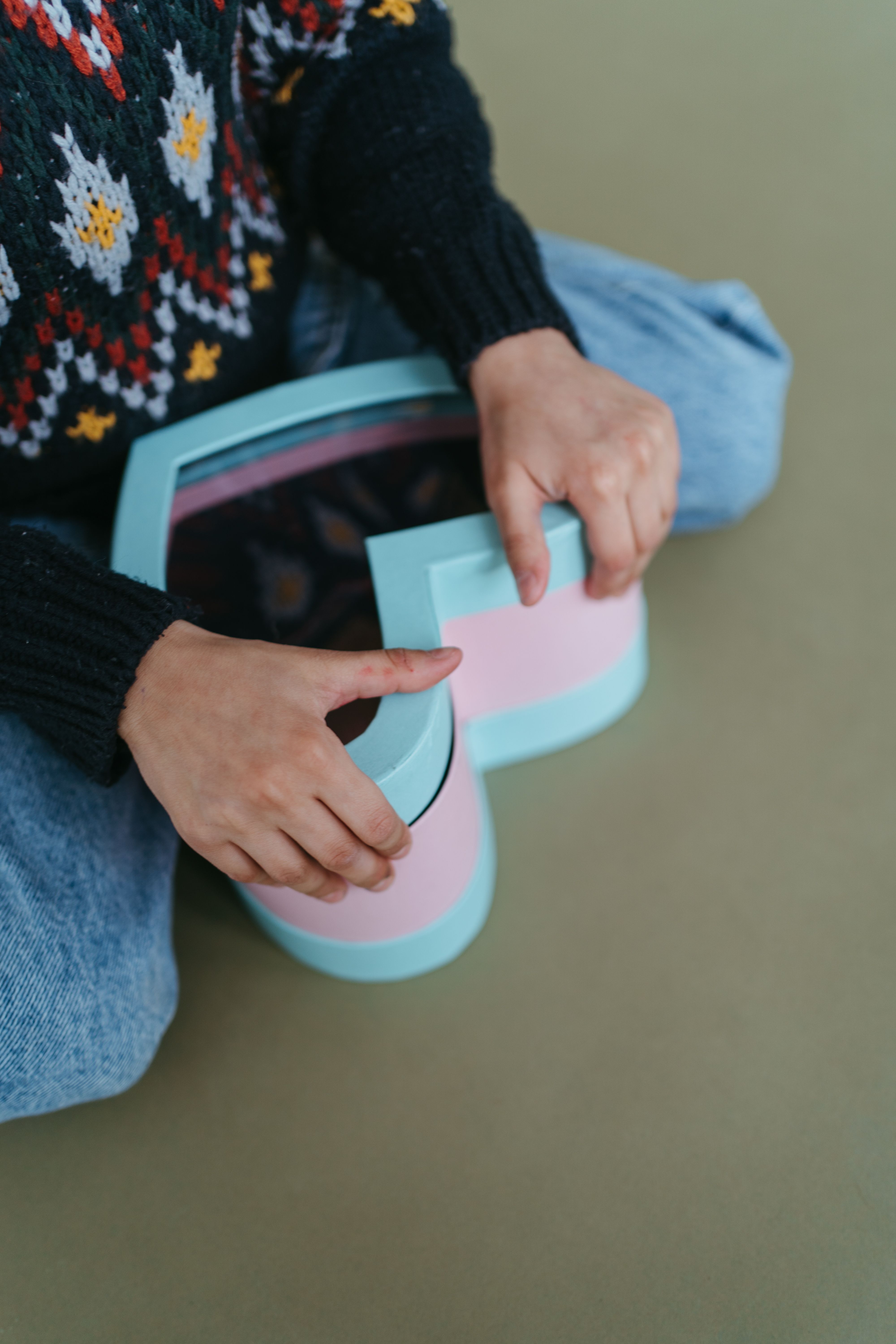 A Child Opening a Heart Container · Free Stock Photo