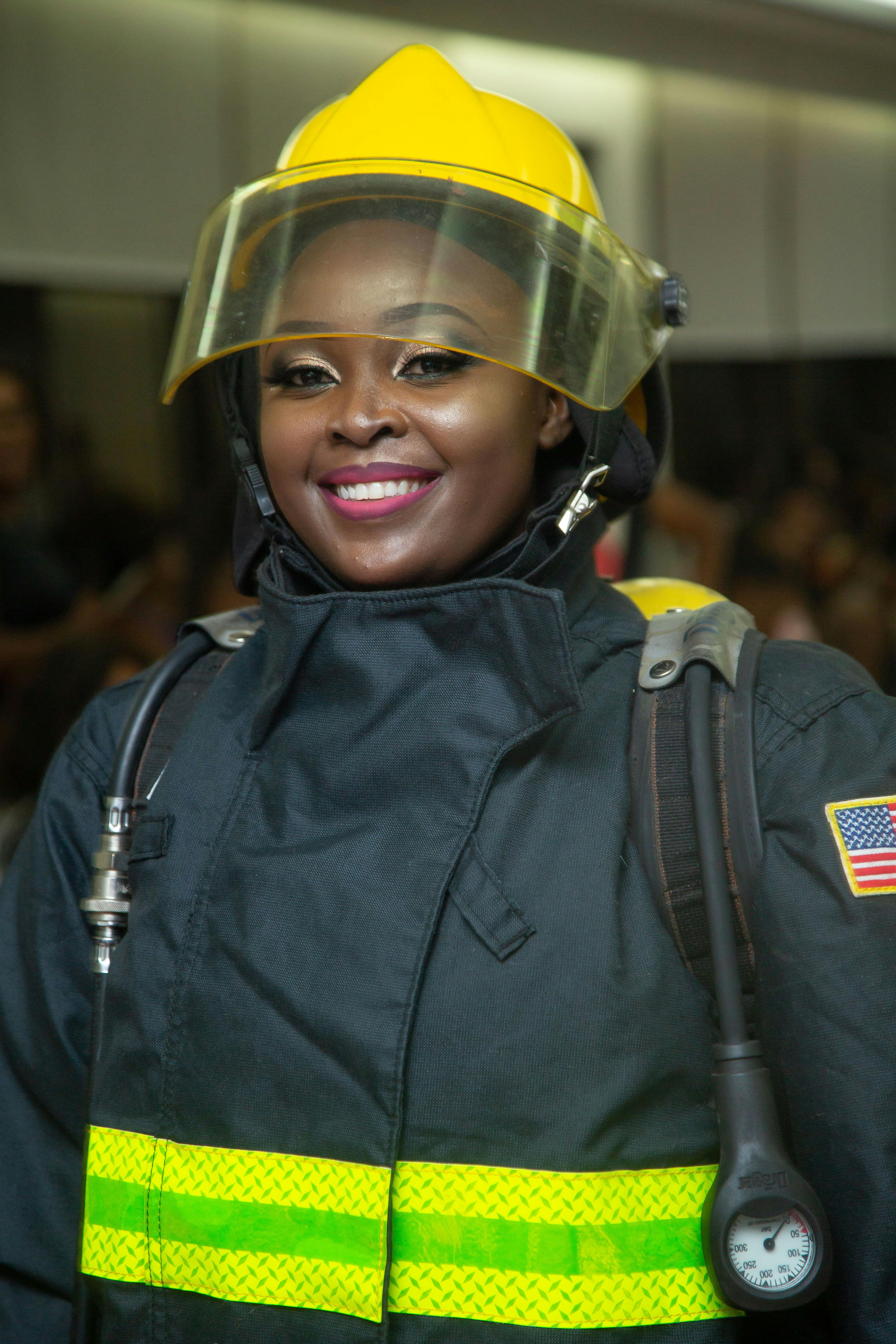 Yellow Hard Hat on Brown and Yellow Fireman's Suit · Free Stock Photo