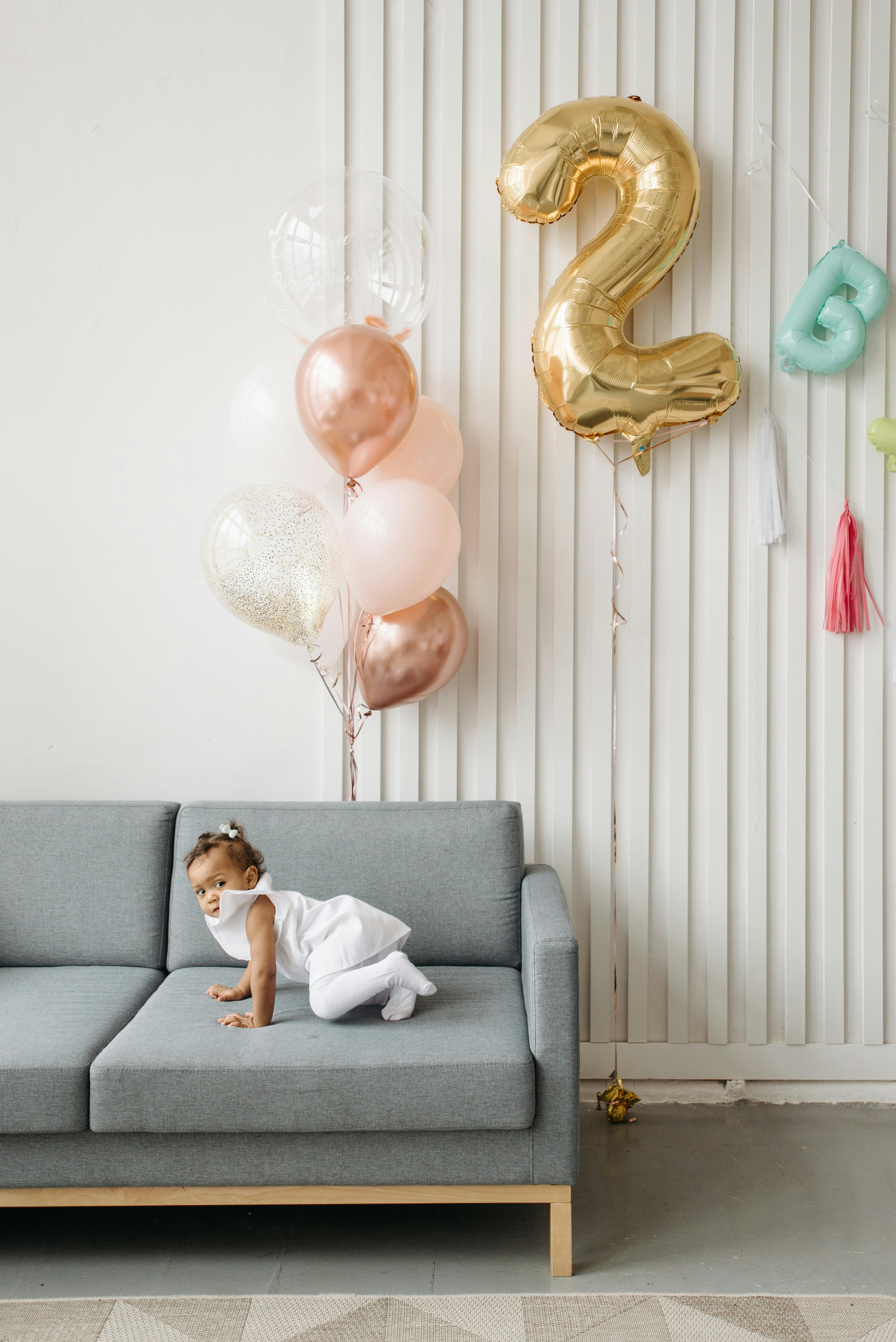 A Kid Sitting on the Couch · Free Stock Photo