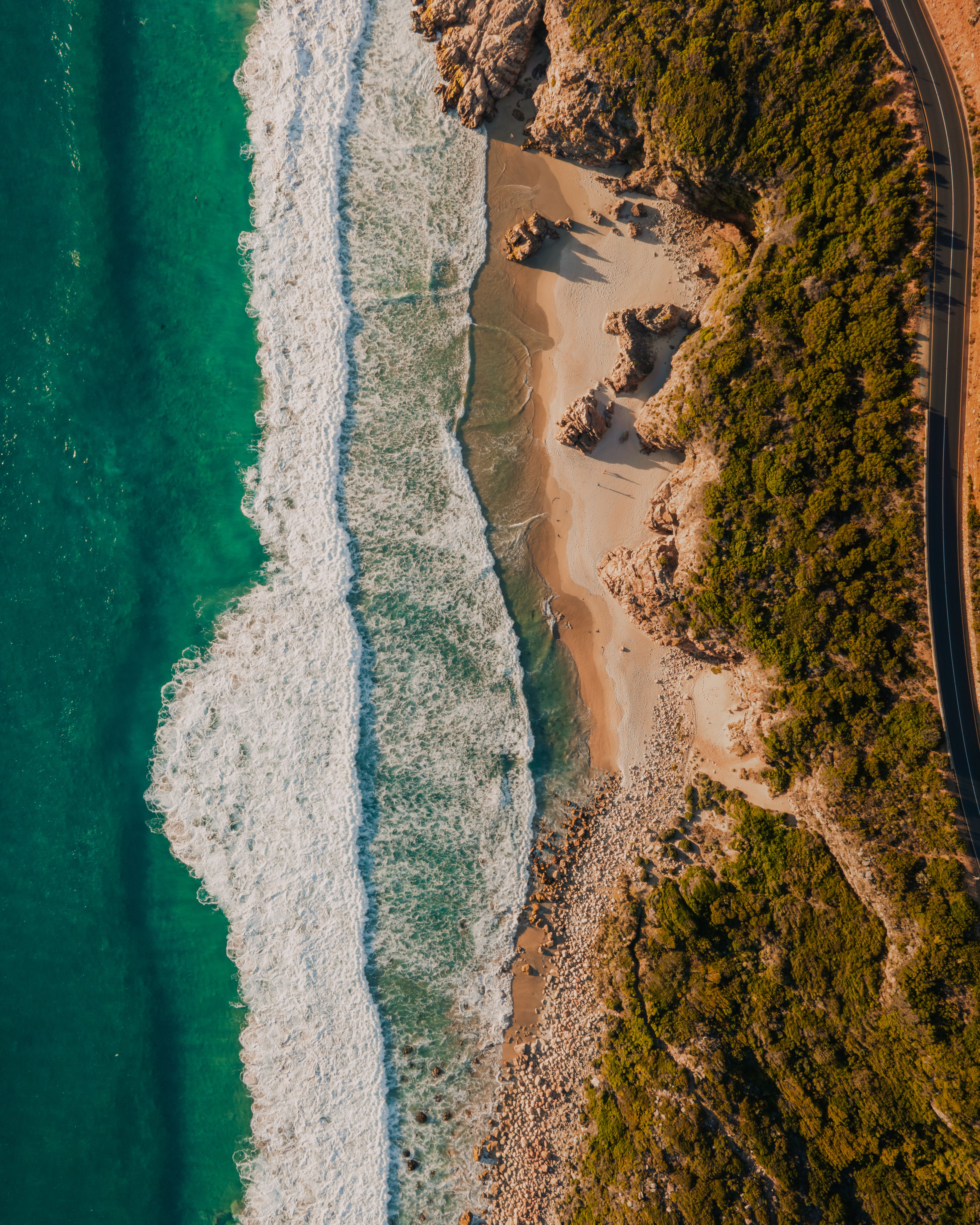 An Aerial View of a Beach with Crashing Waves on the Shore · Free Stock ...