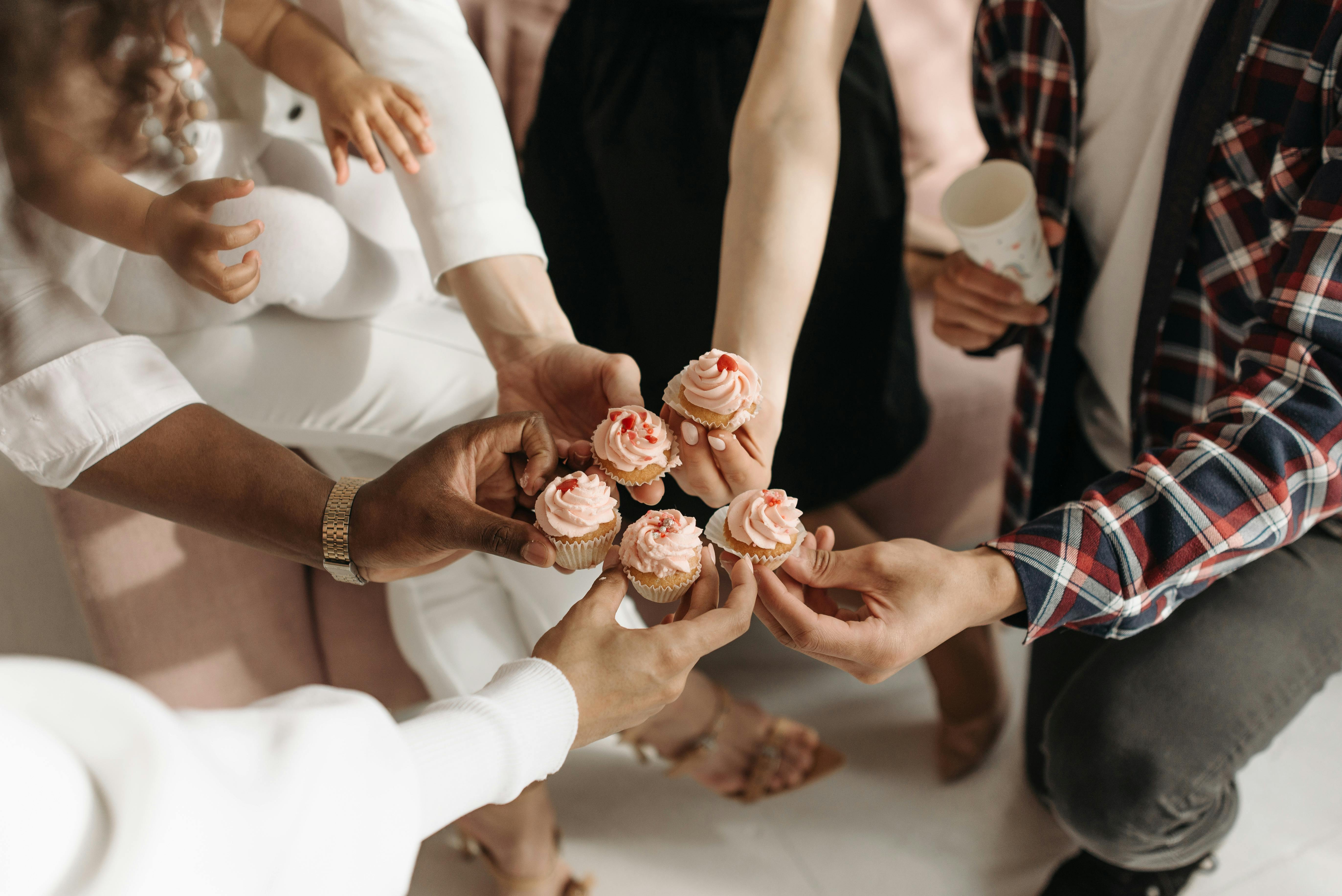 People Holding Five Small Cupcakes · Free Stock Photo