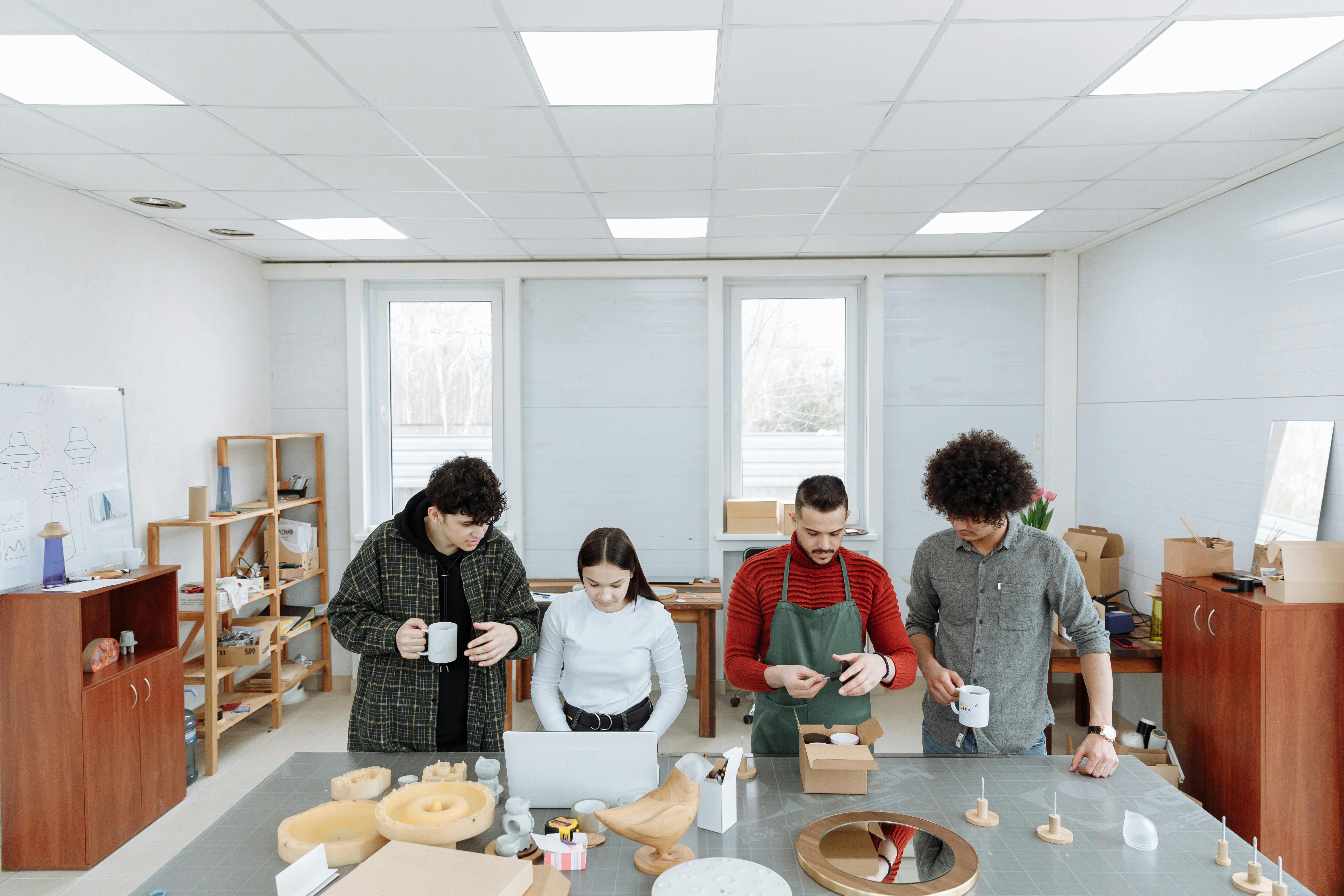 Group of People Standing in Front of Table · Free Stock Photo