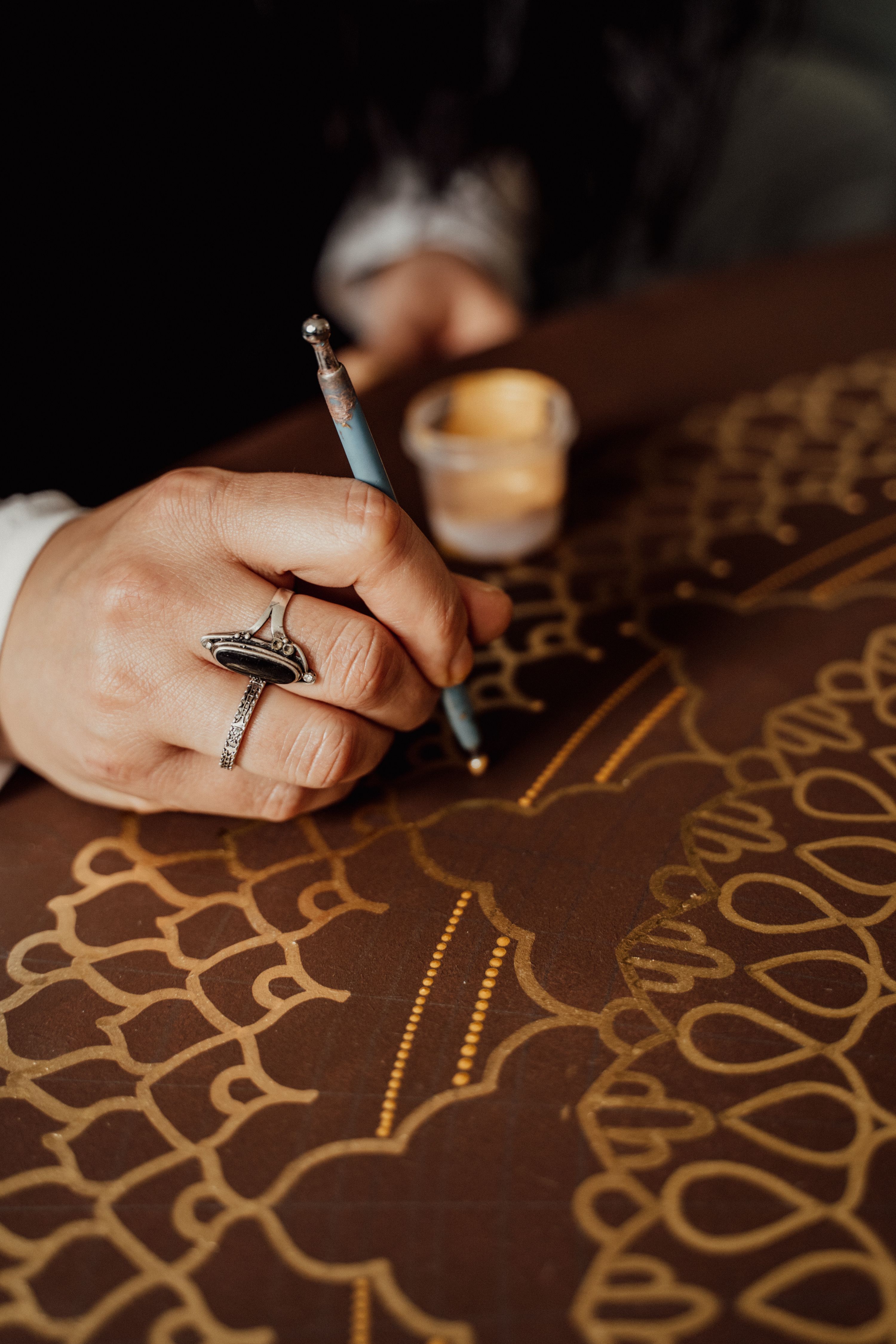 A Close-Up Shot of a Person Dot Painting · Free Stock Photo