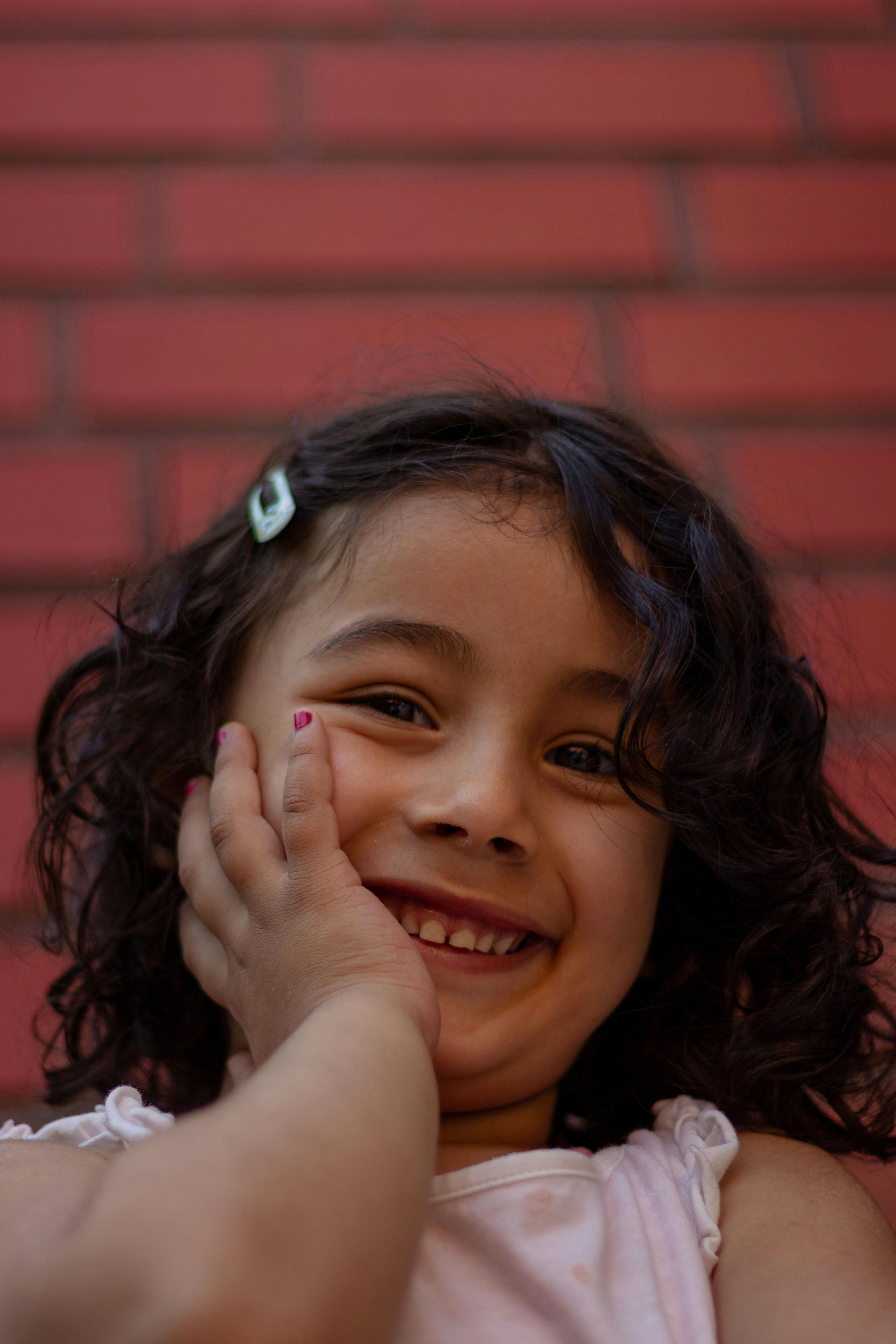 A Girl's Hair being Braided · Free Stock Photo