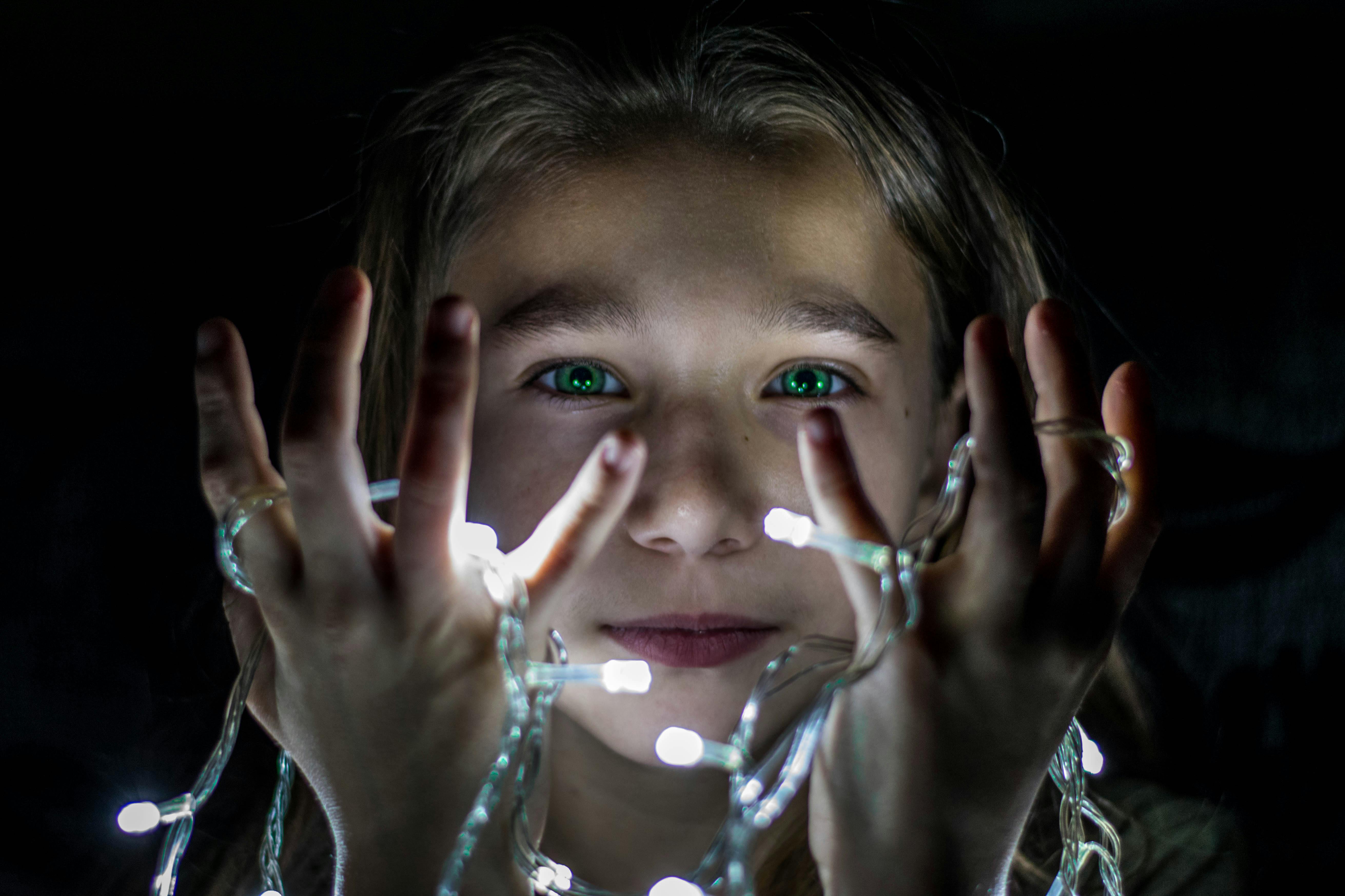 Girl Holding Christmas Lights · Free Stock Photo