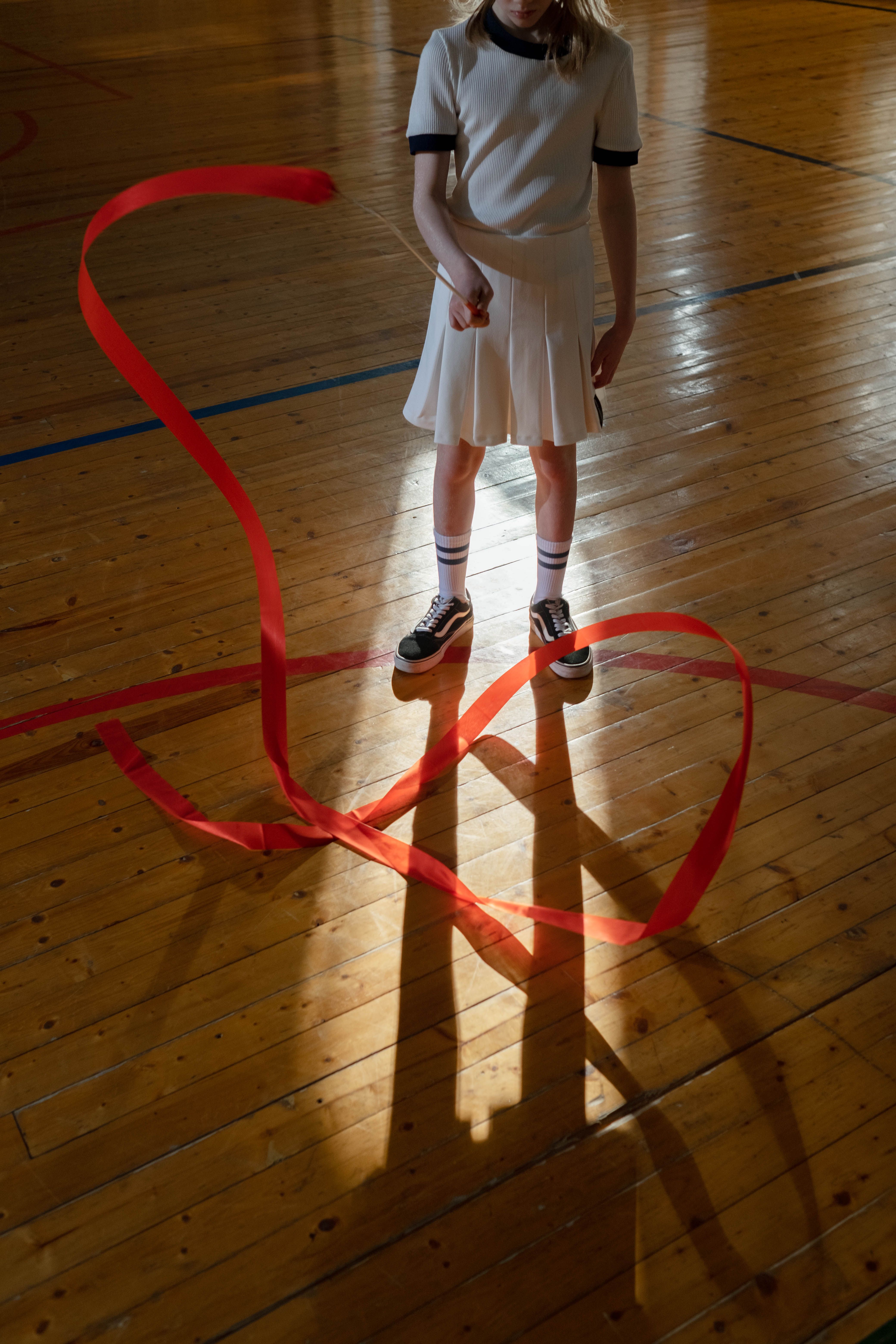 Girl in Orange Sports Wear Doing Hula Hoop · Free Stock Photo