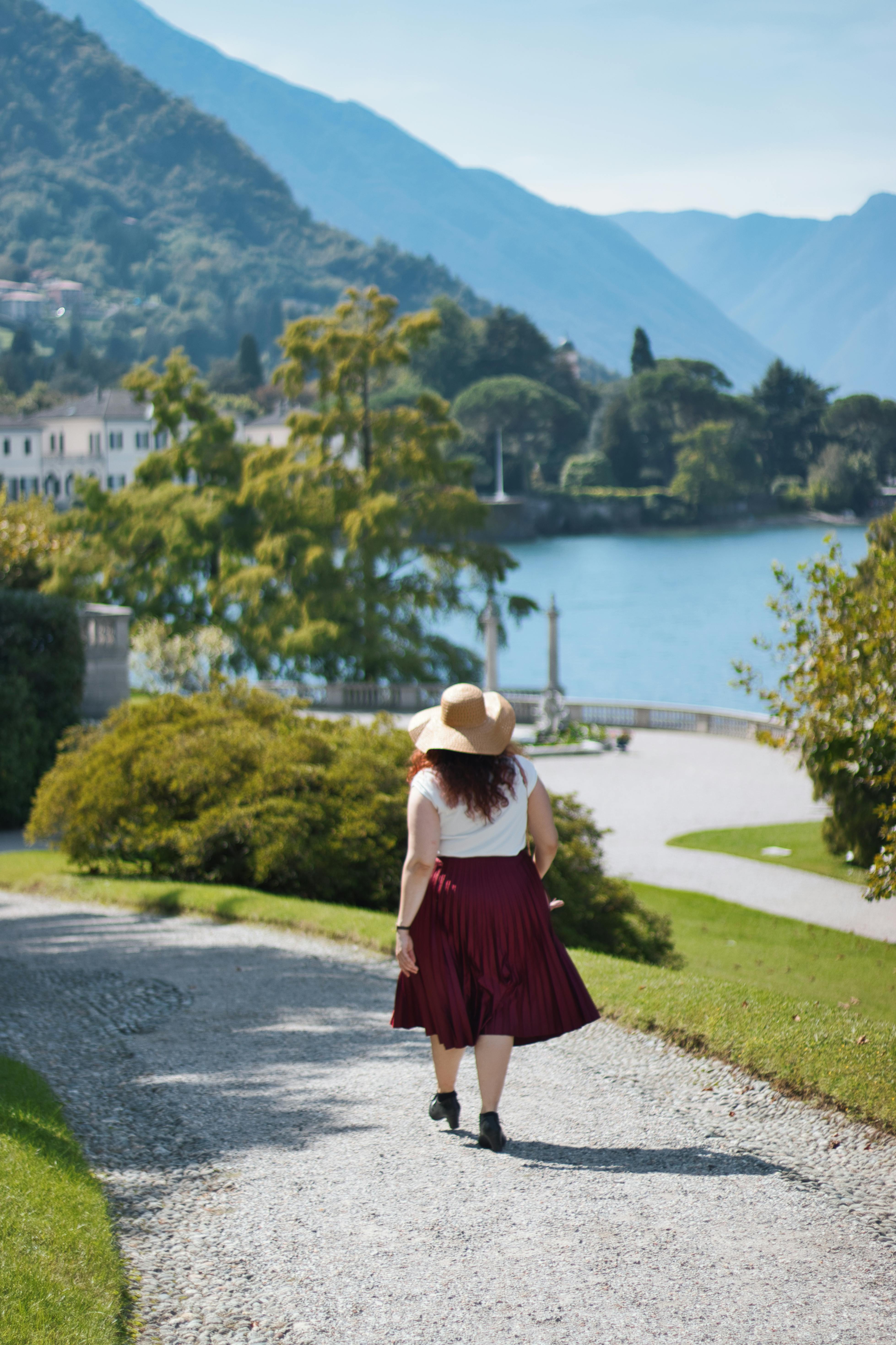 Woman Walking on the Pebble Footpath · Free Stock Photo