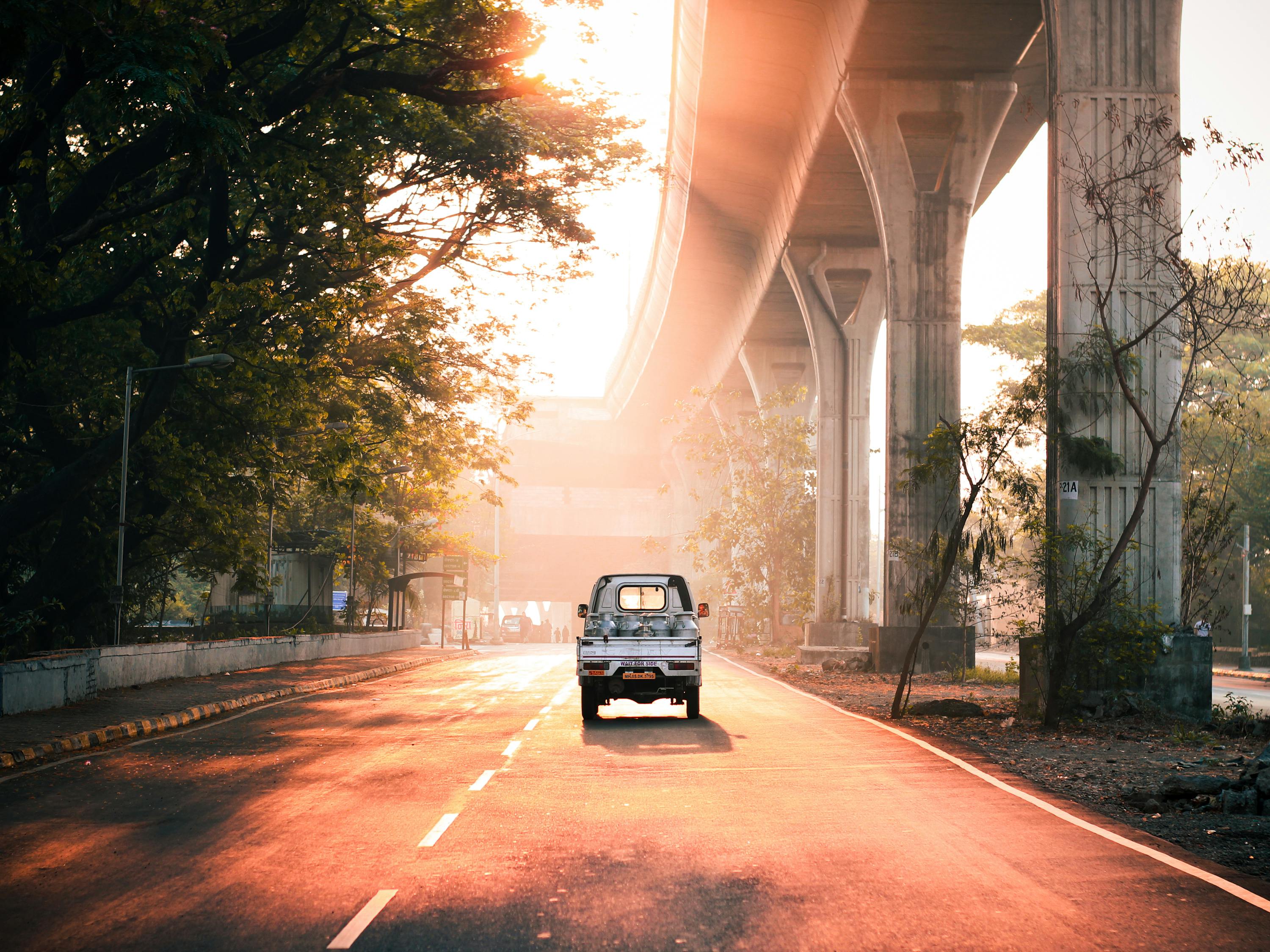 White Car on Road Under the Bridge · Free Stock Photo
