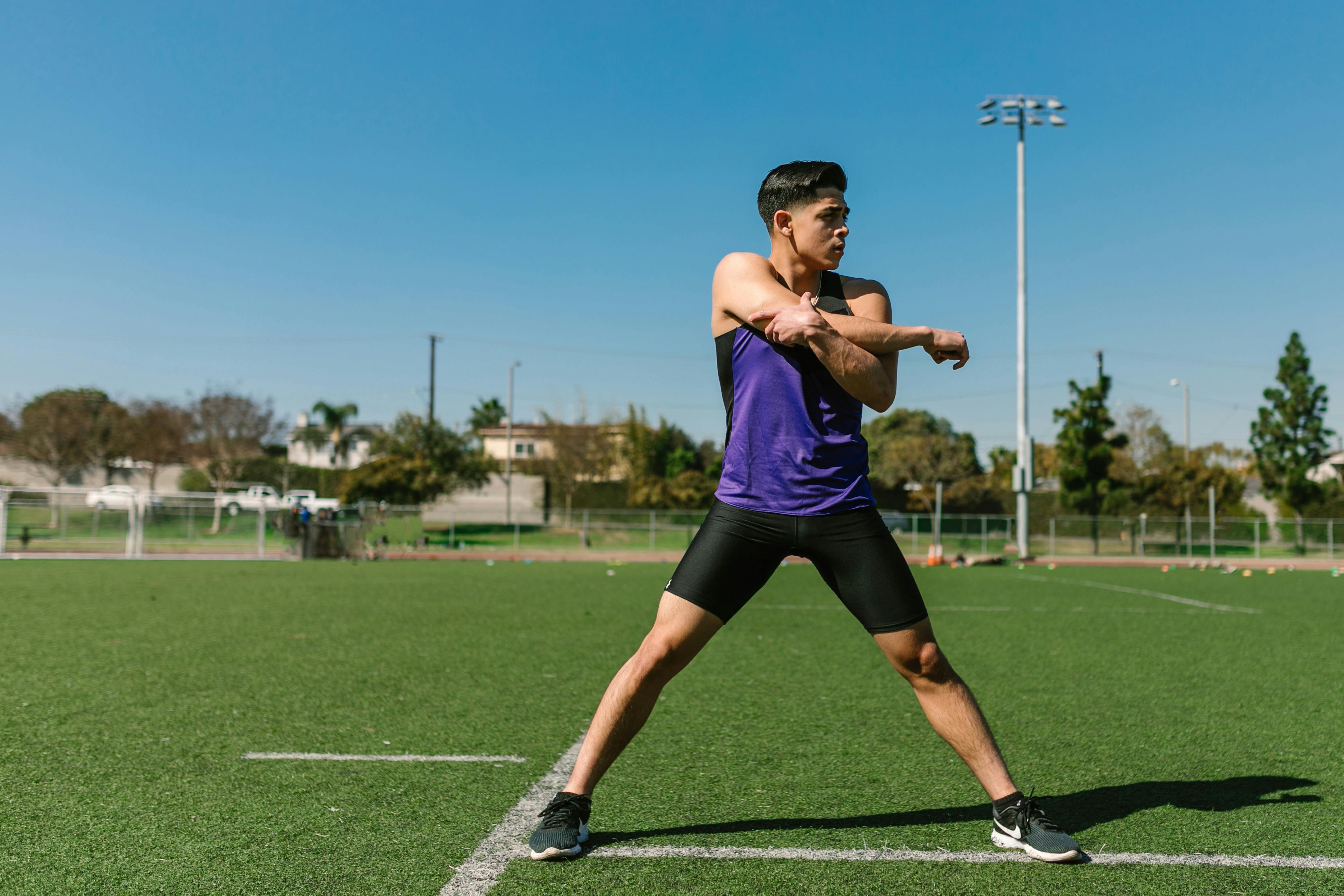 A Football Player Juggling in Soccer Field · Free Stock Photo