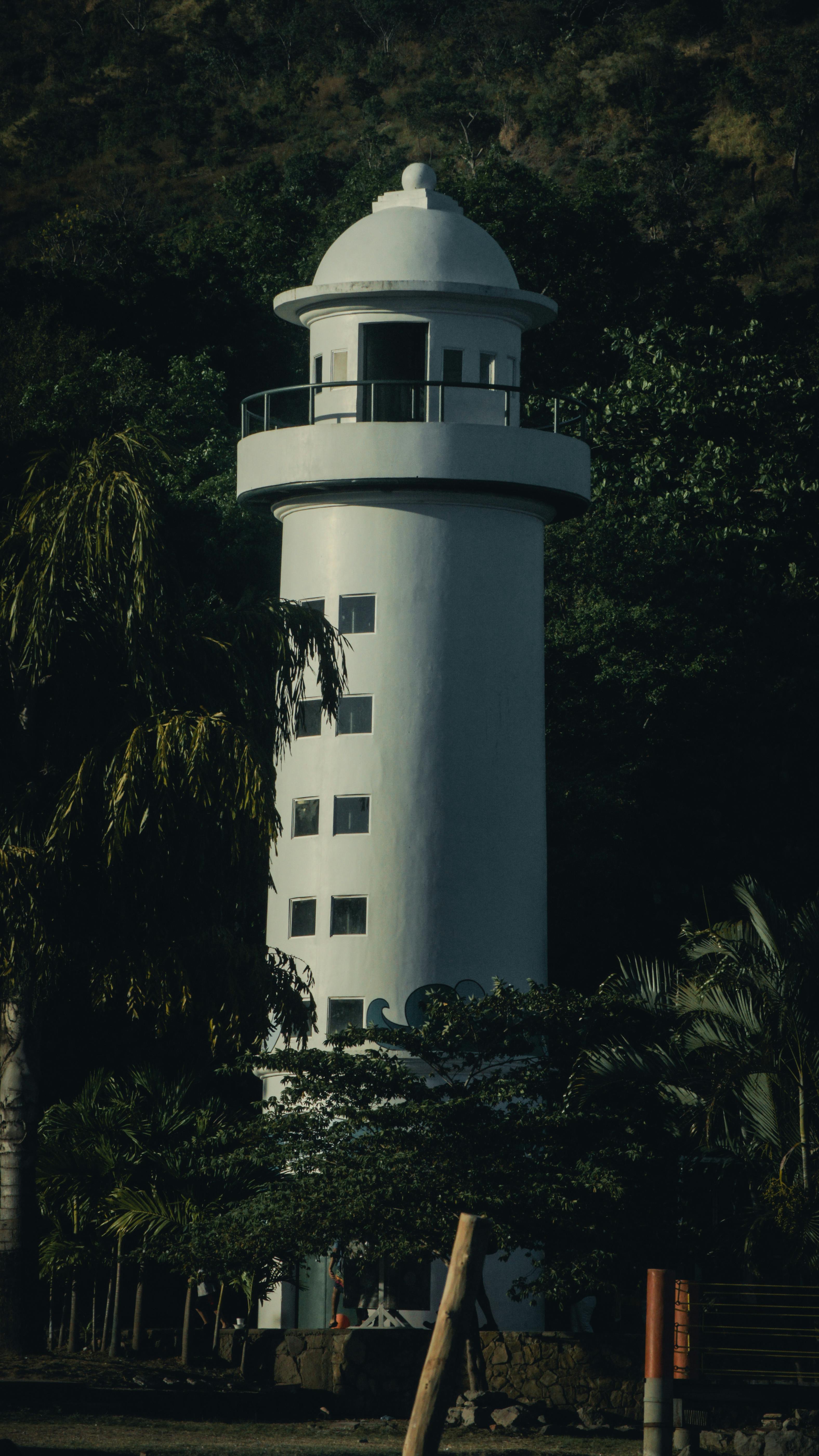 A White and Red Lighthouse · Free Stock Photo
