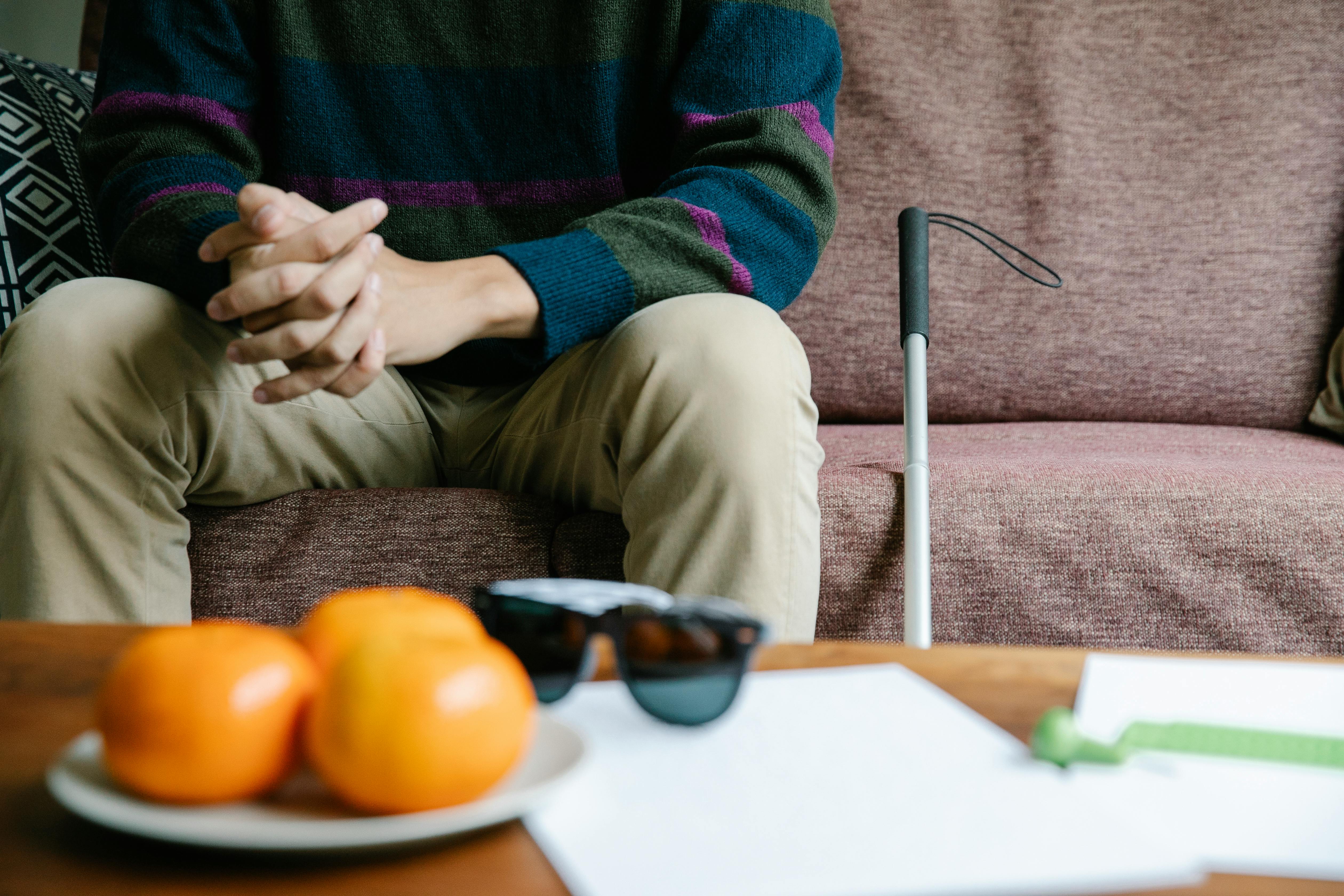 Photo of Person Sitting on Couch · Free Stock Photo