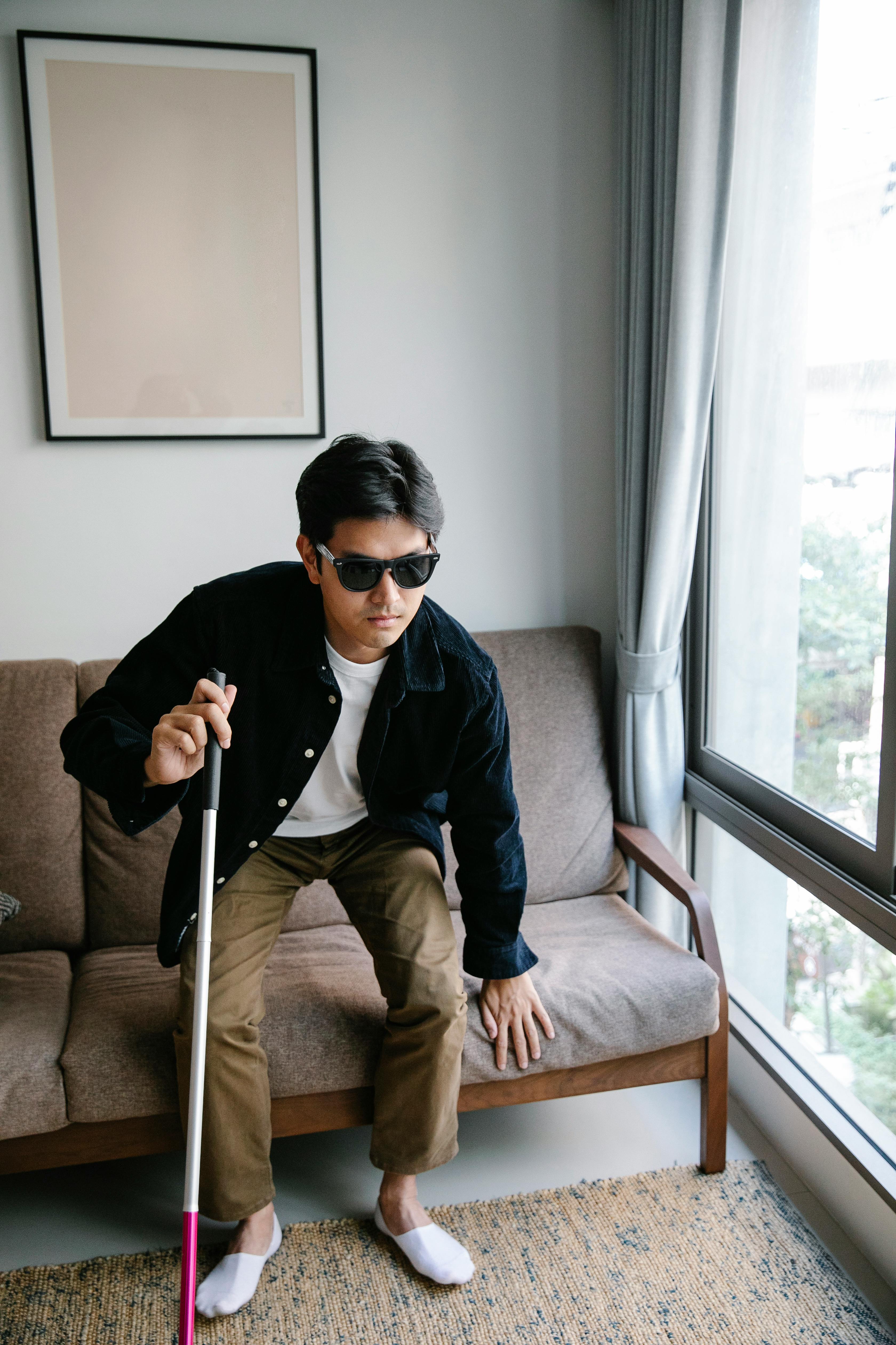 Photo of Person Sitting on Couch · Free Stock Photo